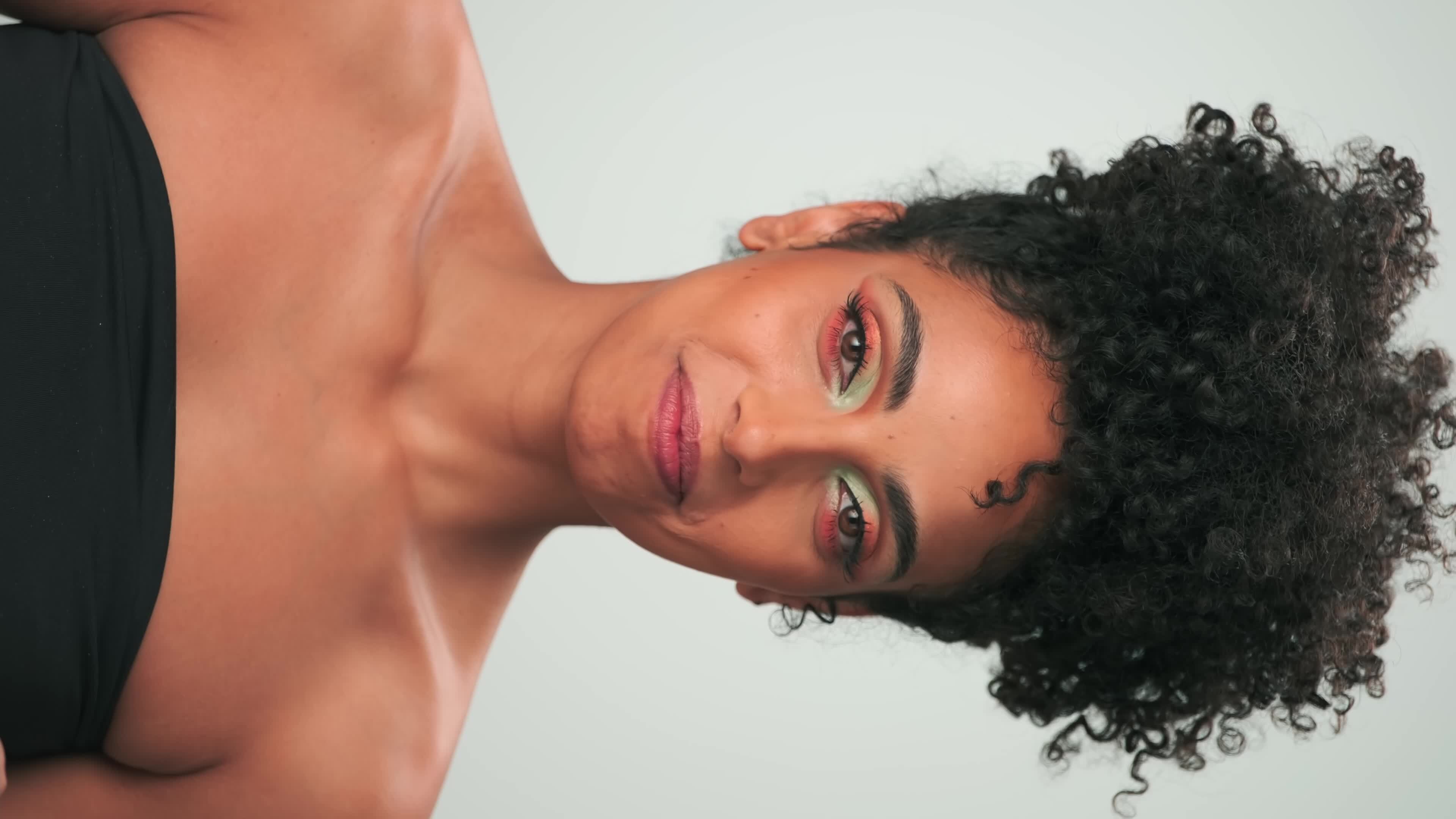 Portrait of young smiling model with curly hair in afro style and ...