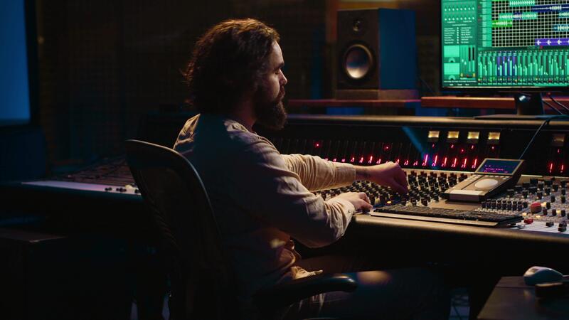 Sound Engineer Mixing And Mastering Tracks In Professional Recording