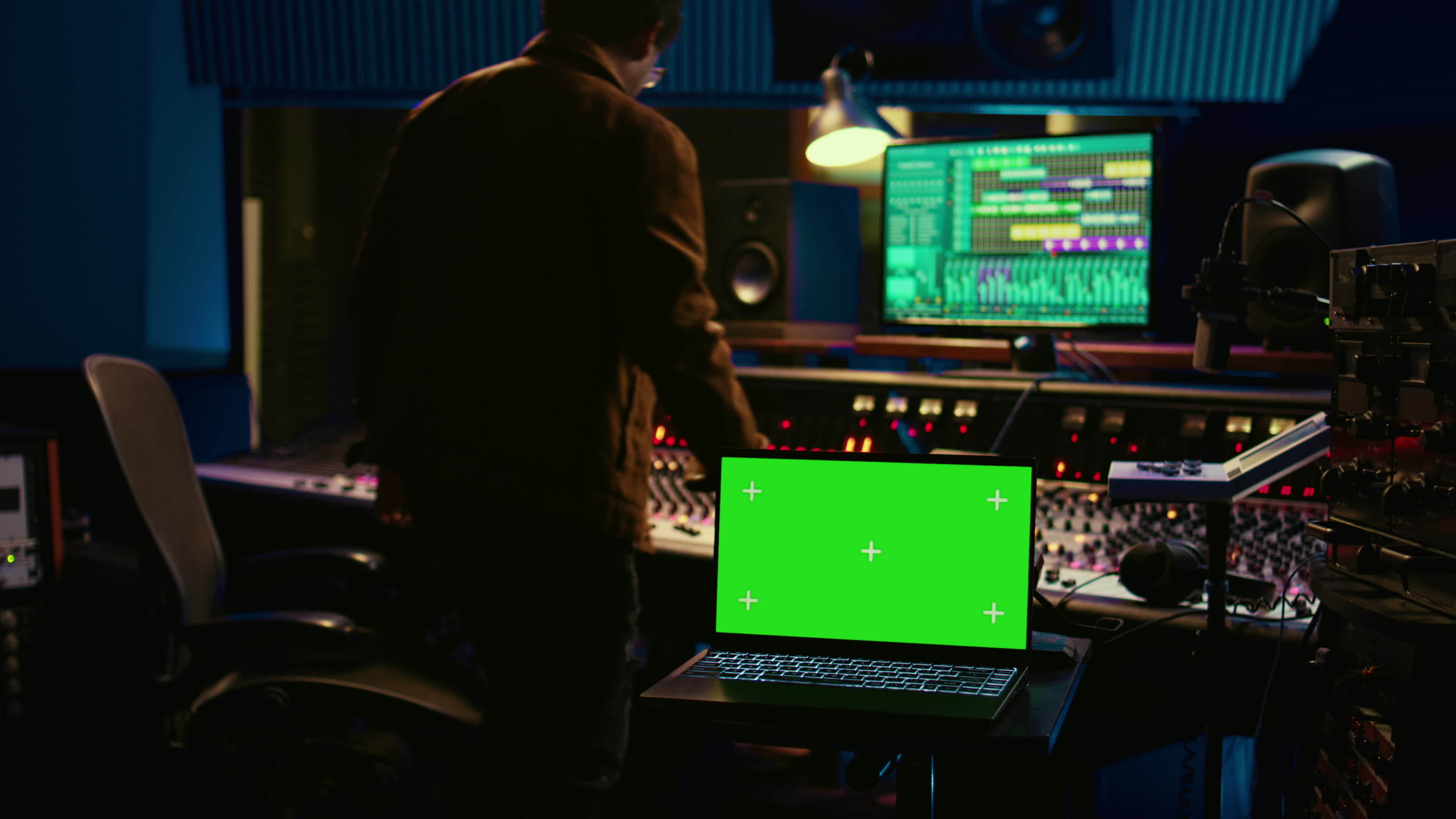 Music Producer Recording Tracks Next To Laptop Showing Mockup Isolated