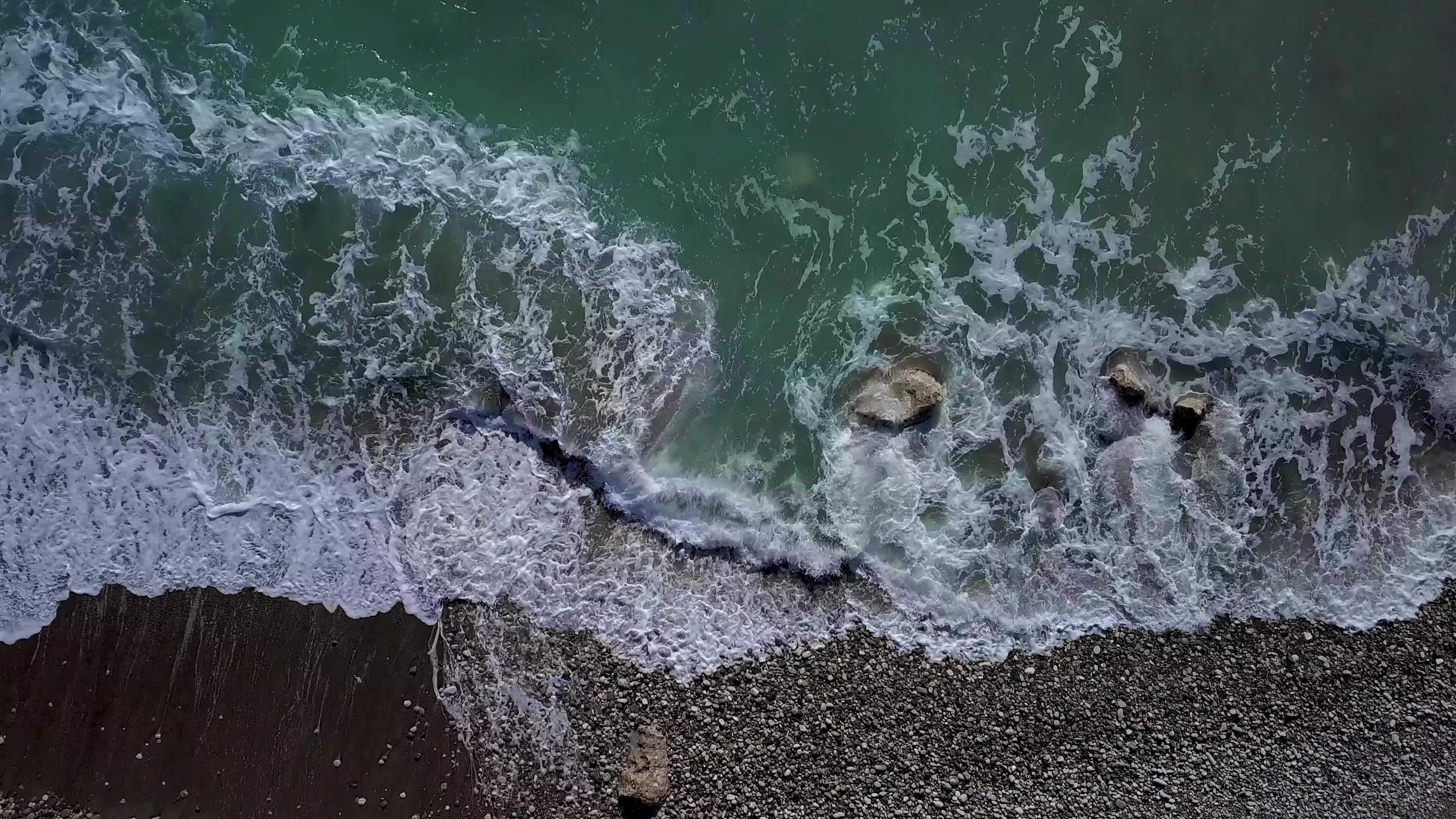 Aerial top view waves break on beach. Sea waves on the beautiful beach ...