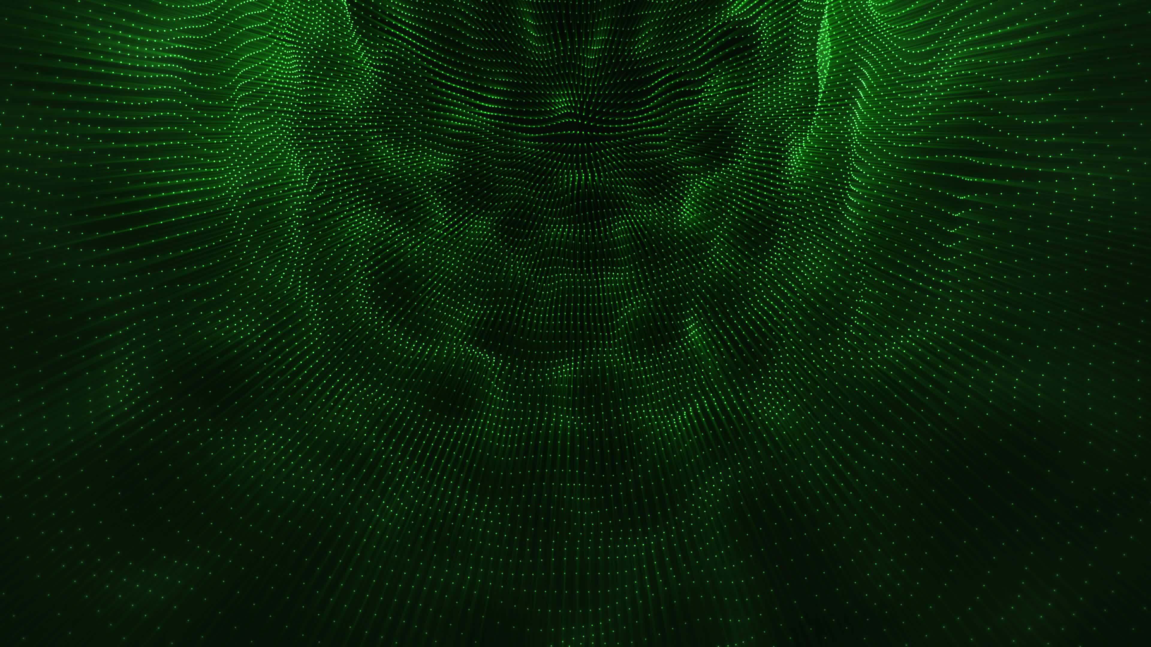 Abstract wavy field made of glowing green particles on a dark background , looped video, 4k , 60 ...