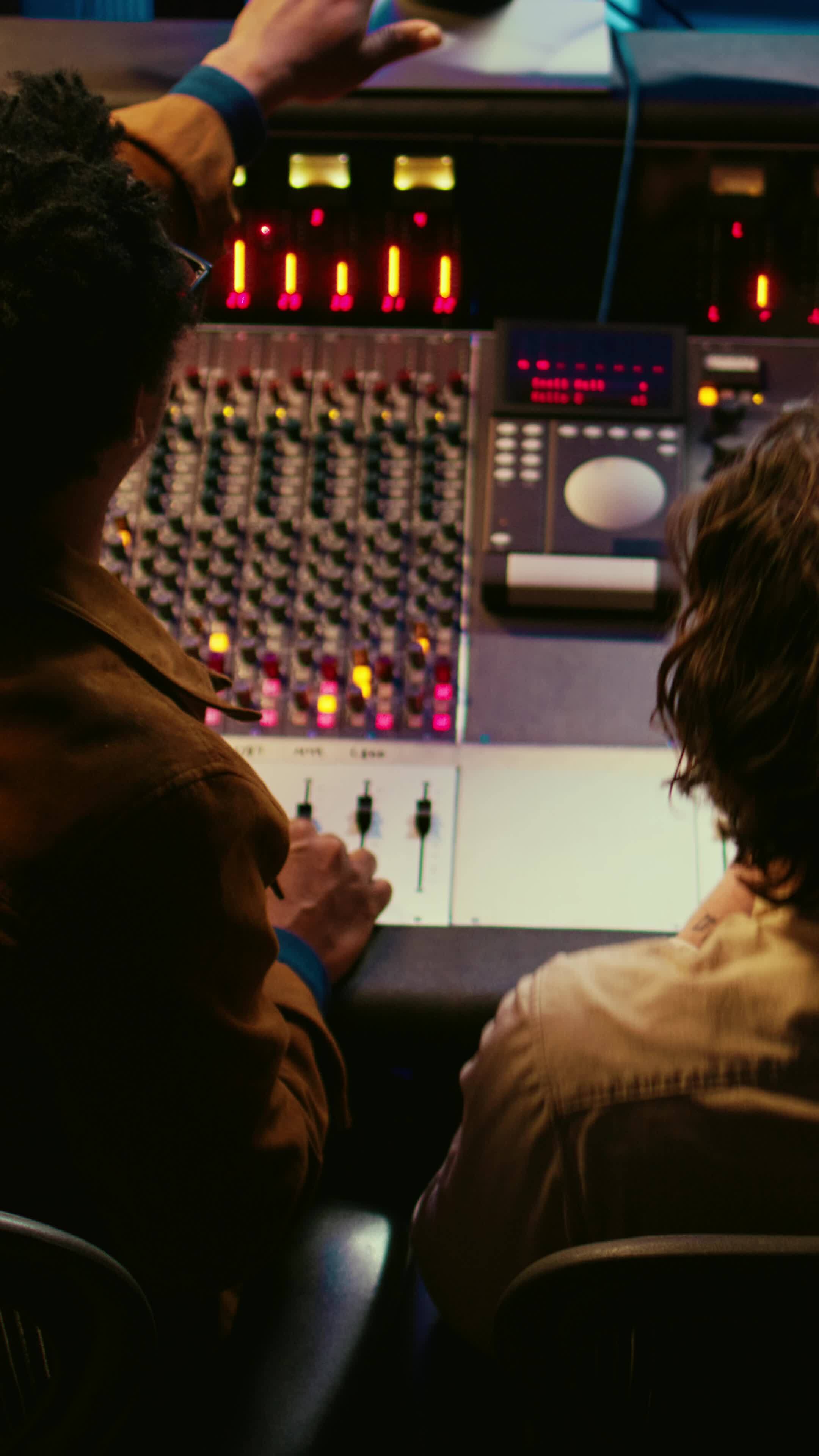 Vertical Team Of Sound Engineers Working On Recording And Editing