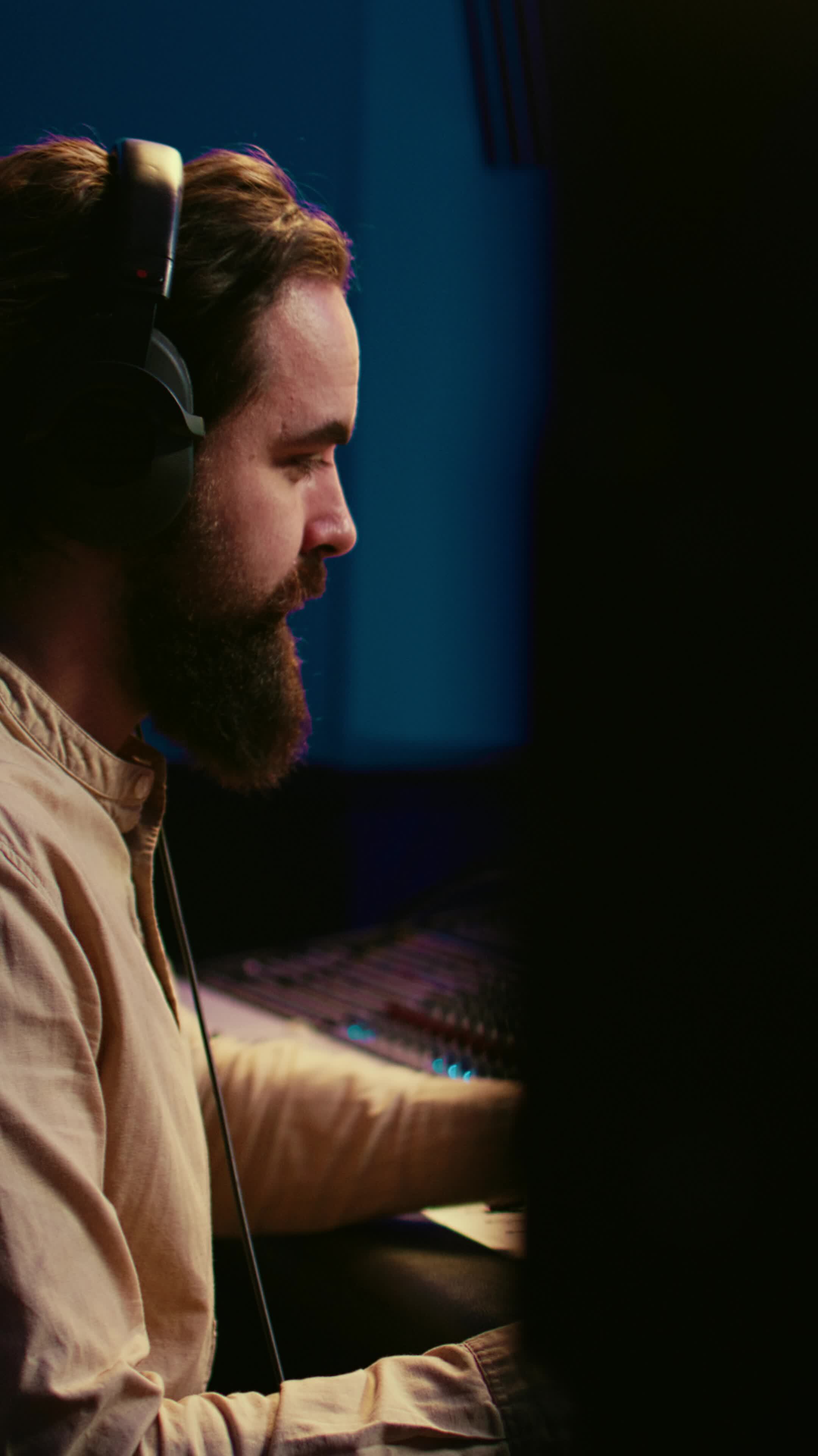 Vertical Audio Expert Operating Motorized Faders And Mixing Console In