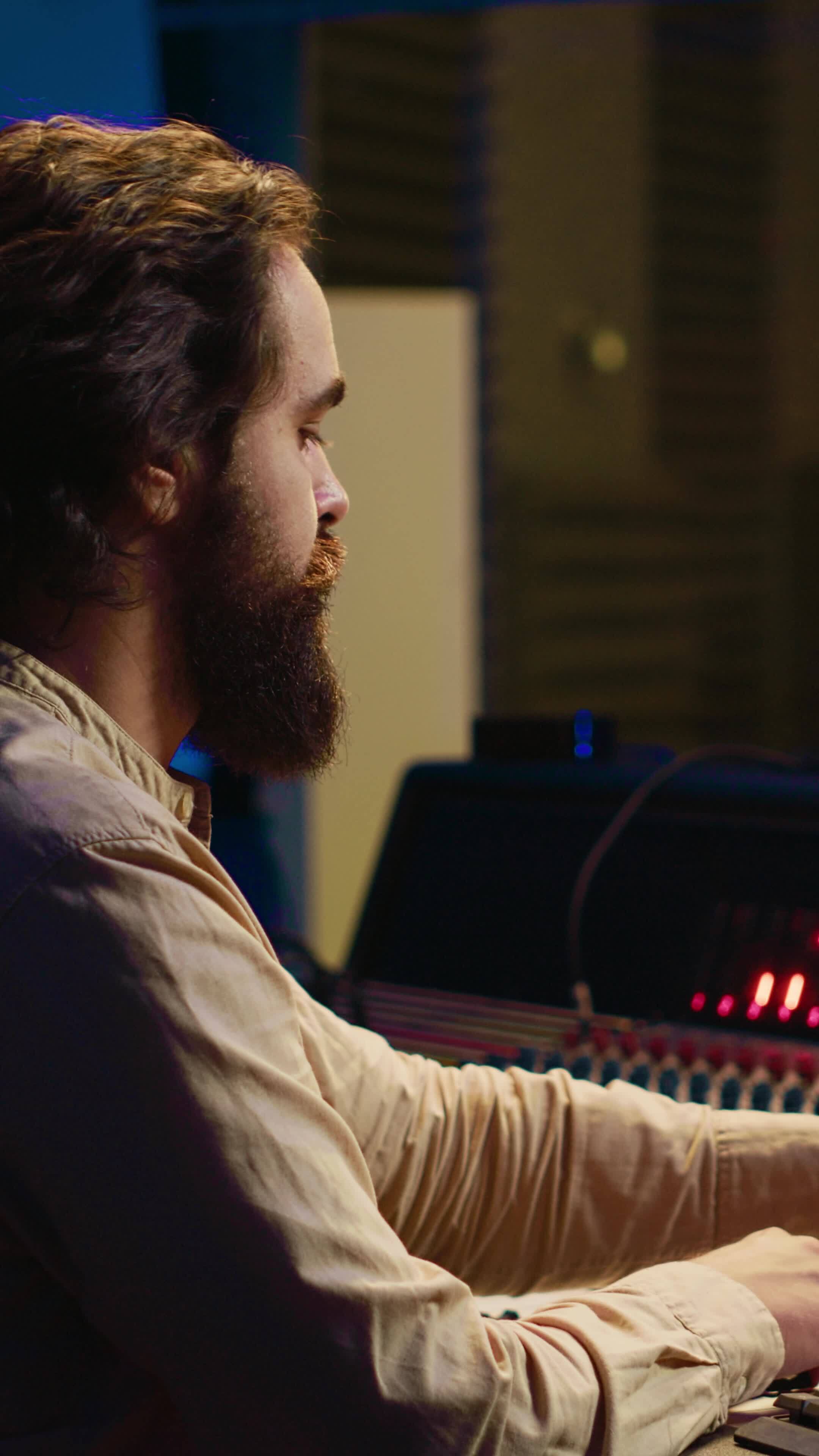 Vertical Control Room Sound Engineer Editing Music With Sliders And