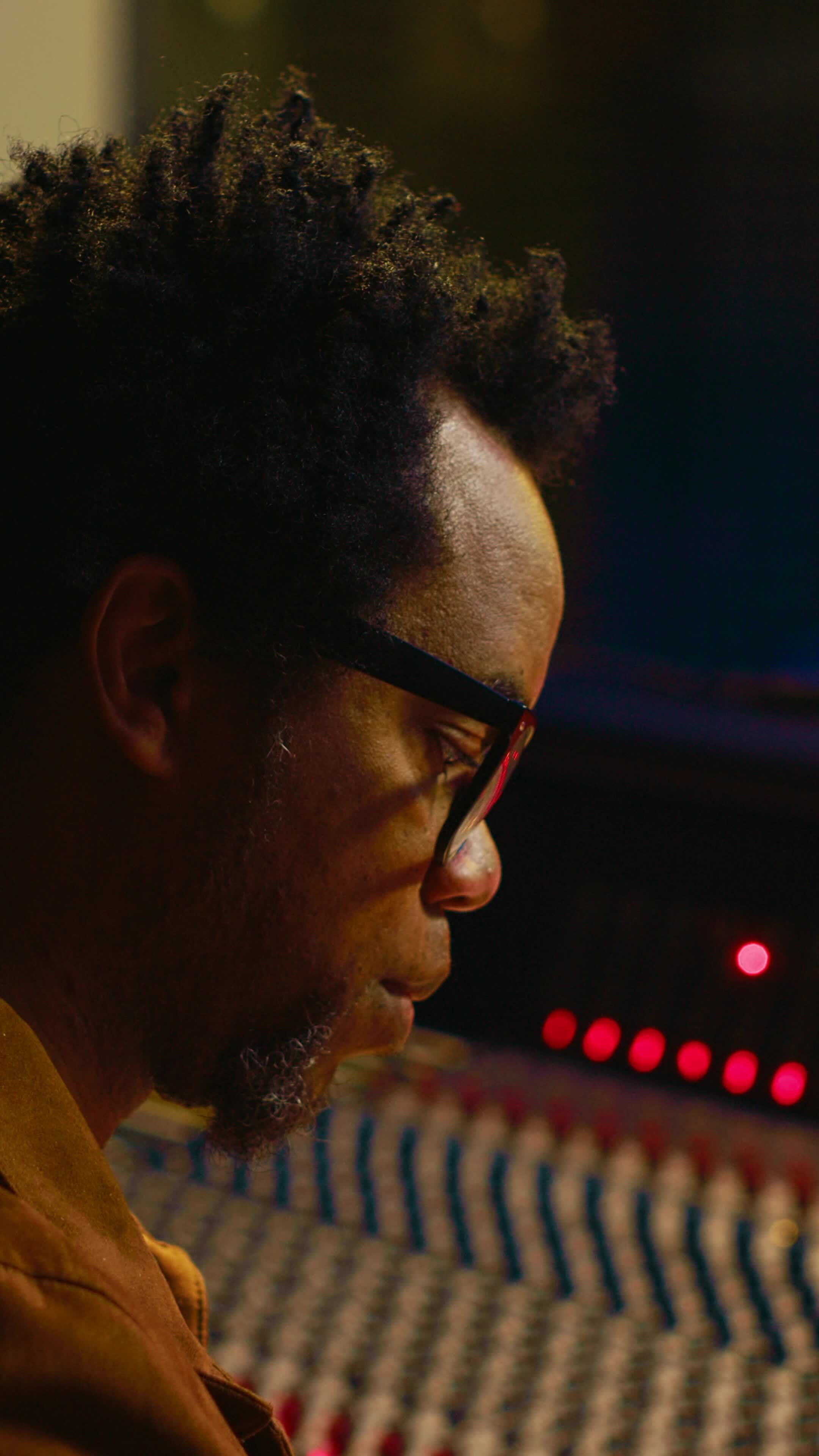 Vertical African American Producer Uses Control Desk With Automatic