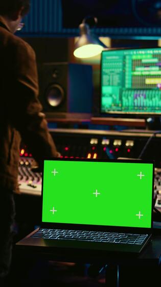 Vertical Music Producer Recording Tracks Next To Laptop Showing Mockup Isolated Display Working