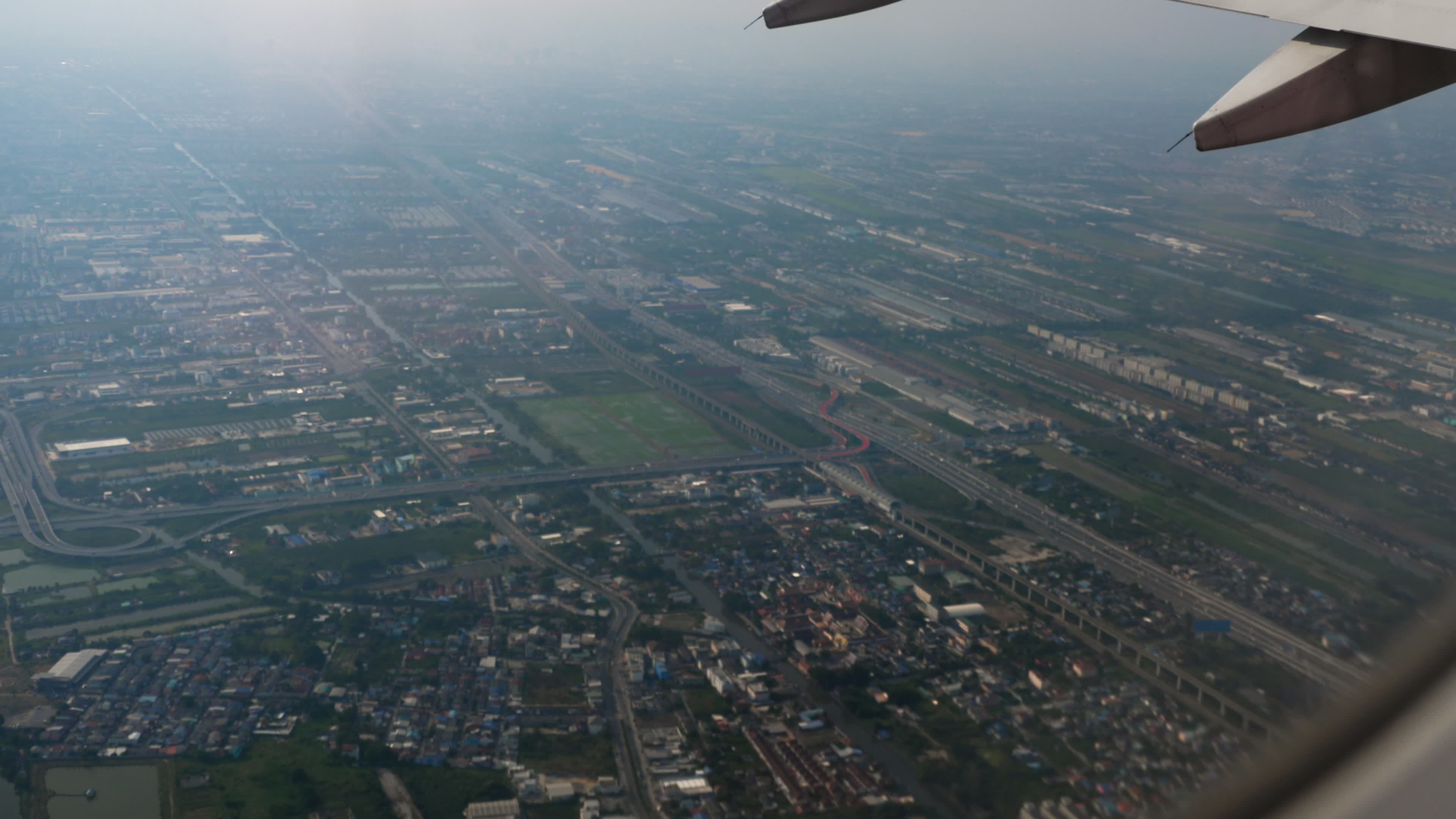 Passenger Plane Flying Over The City Top View From The Window Airliner In The Sky Pov View