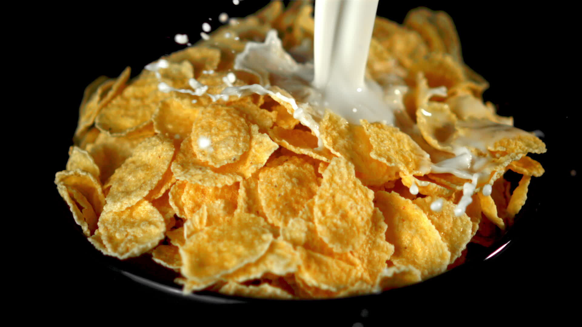 Super Slow Motion On Cornflakes Pours Milk With Splashes Filmed On A High Speed Camera At 1000