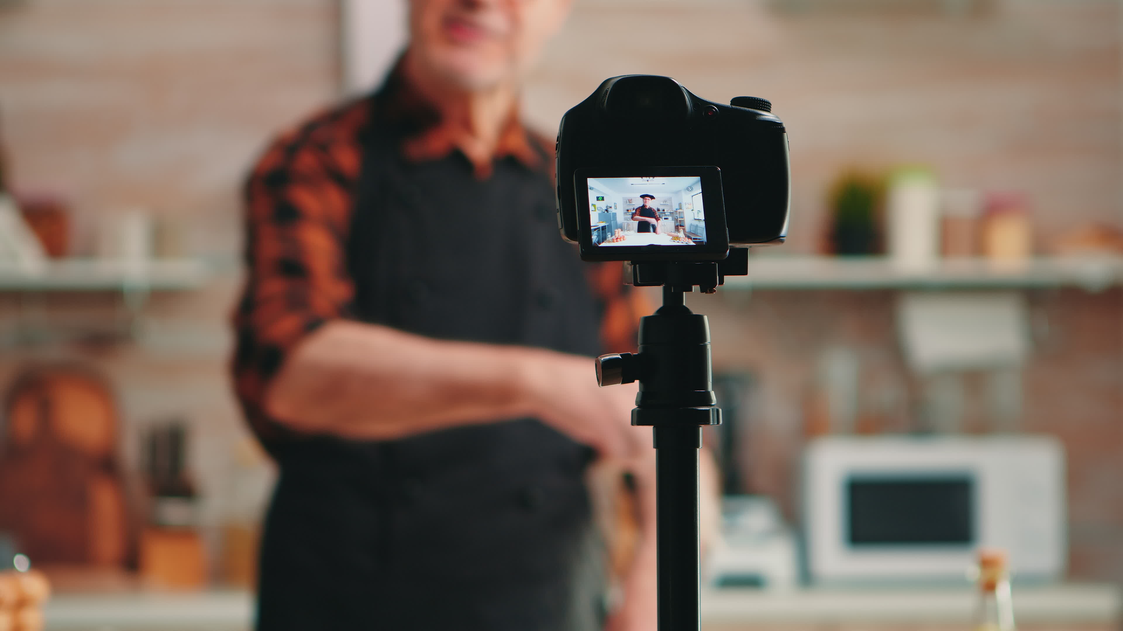 Baker presenting how using wheat flour while recording tutorial. Retired blogger chef influencer ...