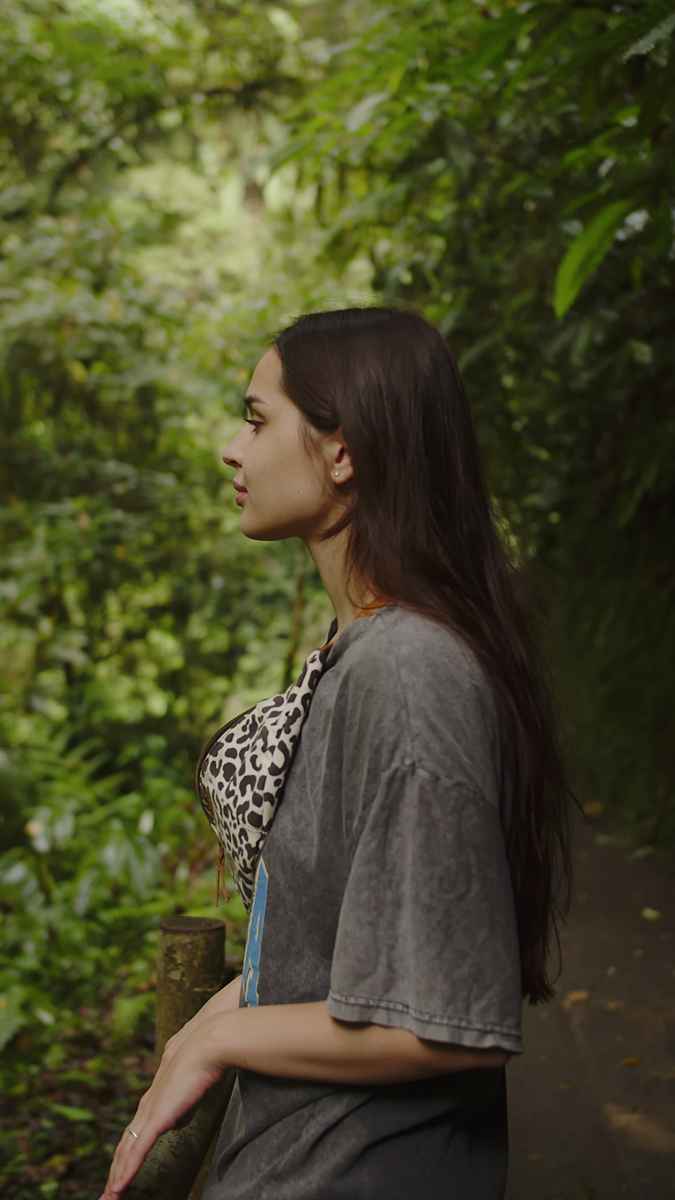 Girl strokes the railing on a bamboo path in the middle of the forest and smiles 44308352 Stock ...