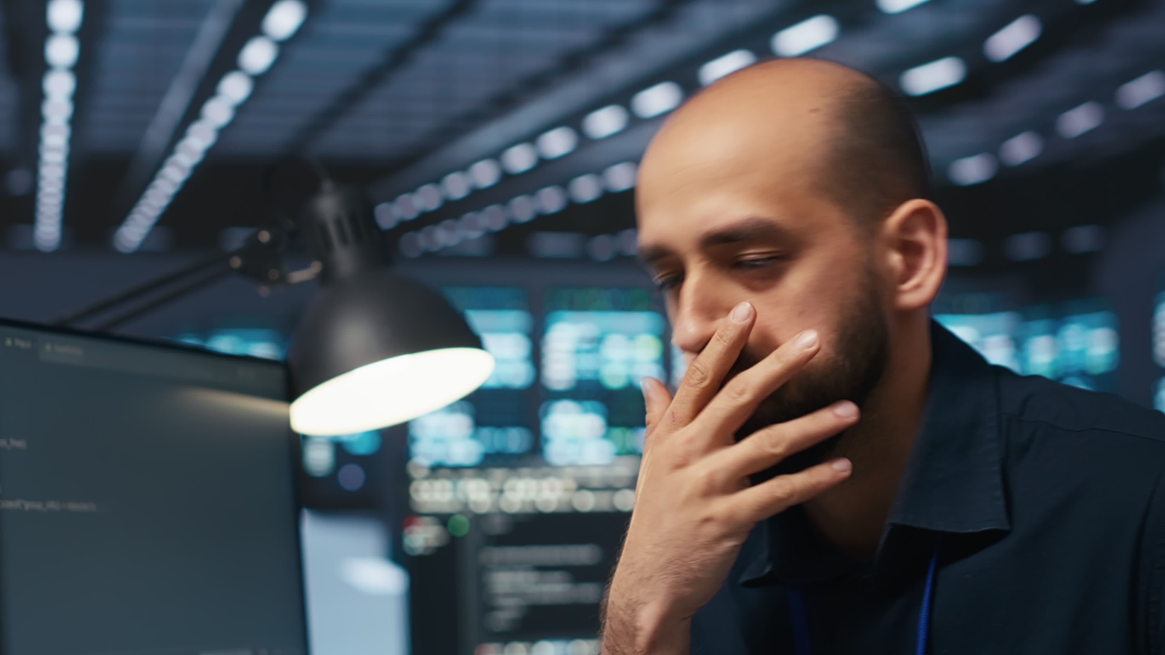 Overworked engineer feeling stressed while coding in data center ... Overworked engineer feeling stressed while coding in data center ...