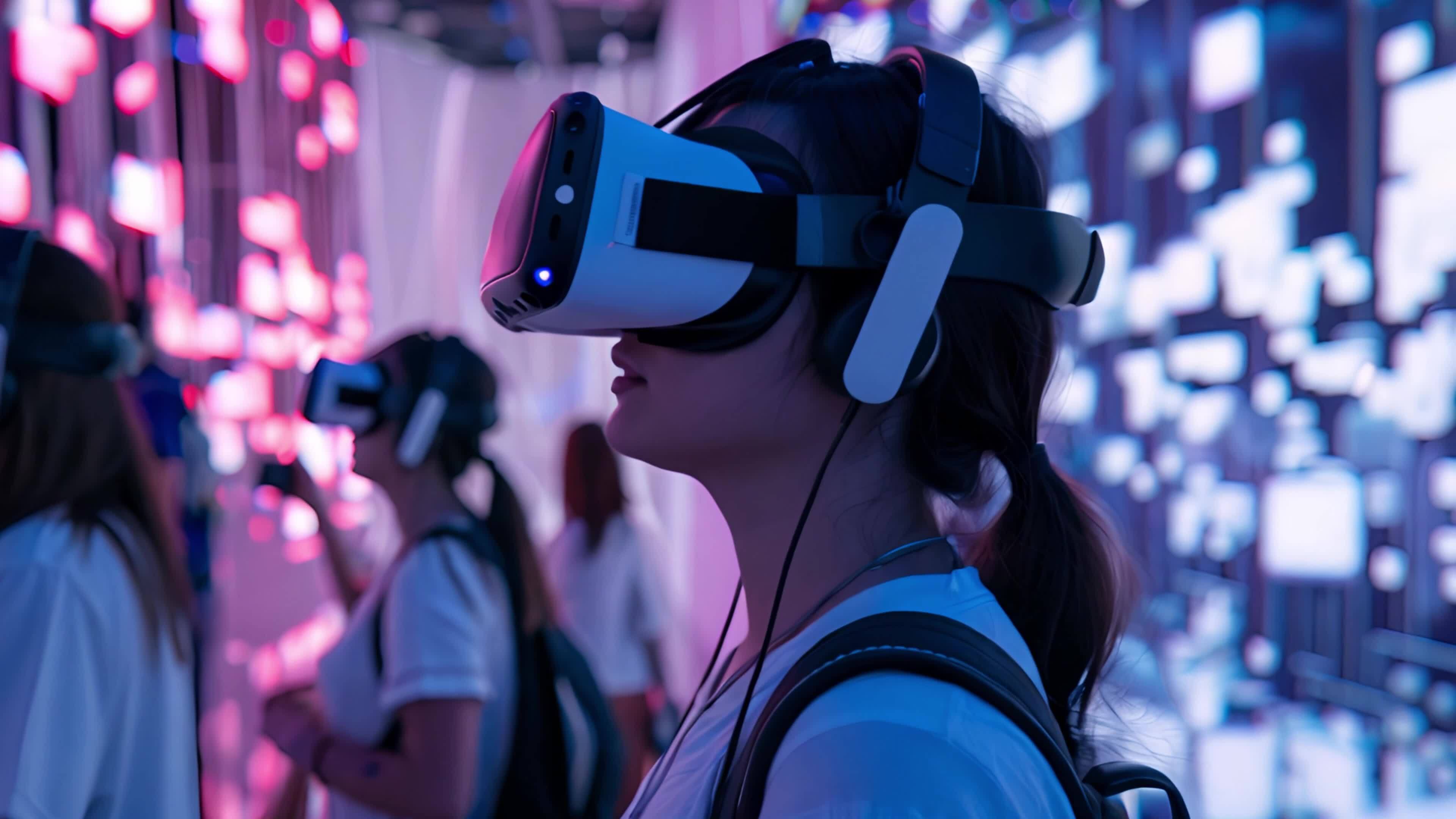 Several individuals immersed in virtual reality experiences, wearing VR headsets in a group ...