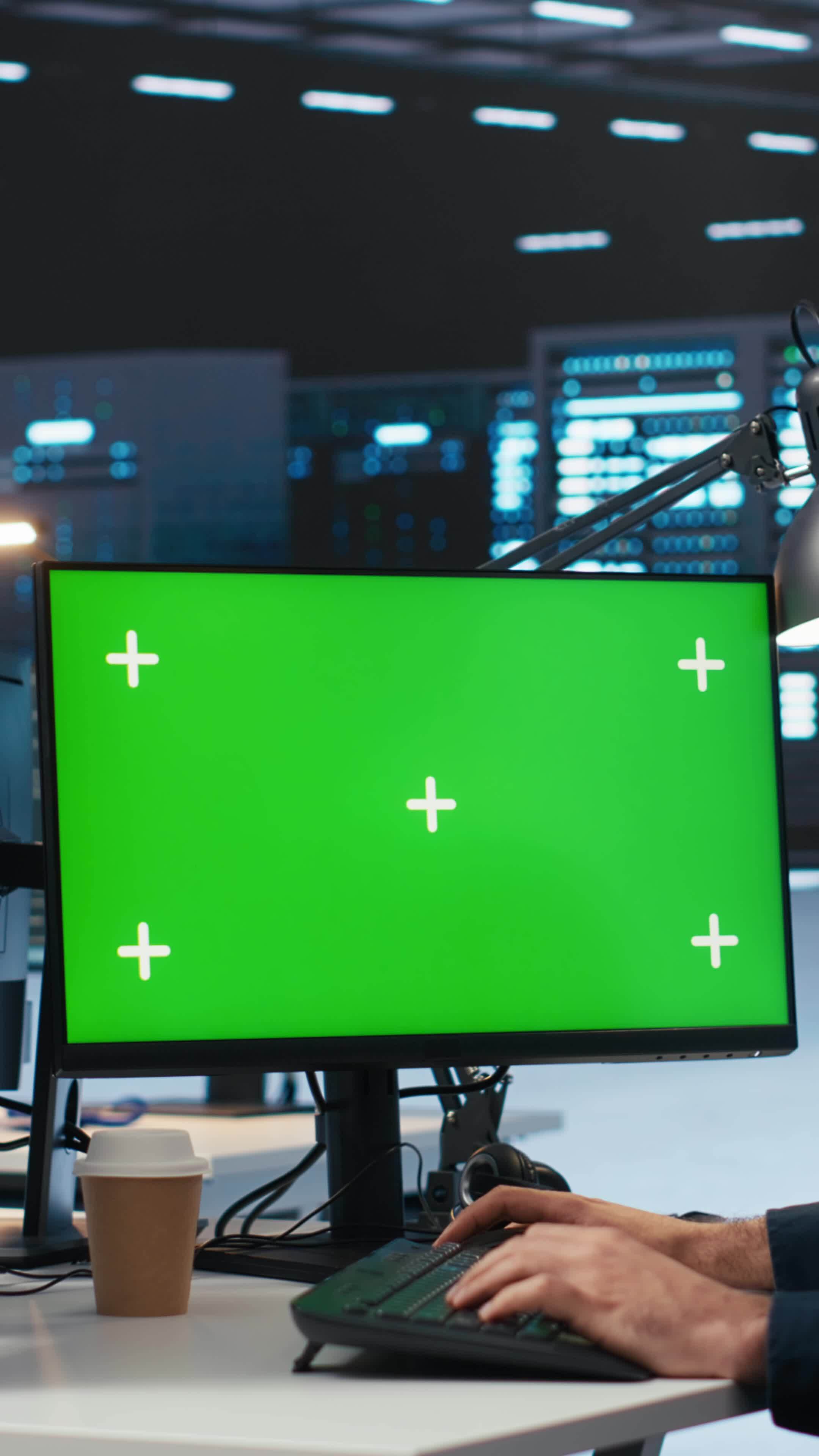 Vertical Technician Overseeing Server Room Running Code On Green Screen Computer