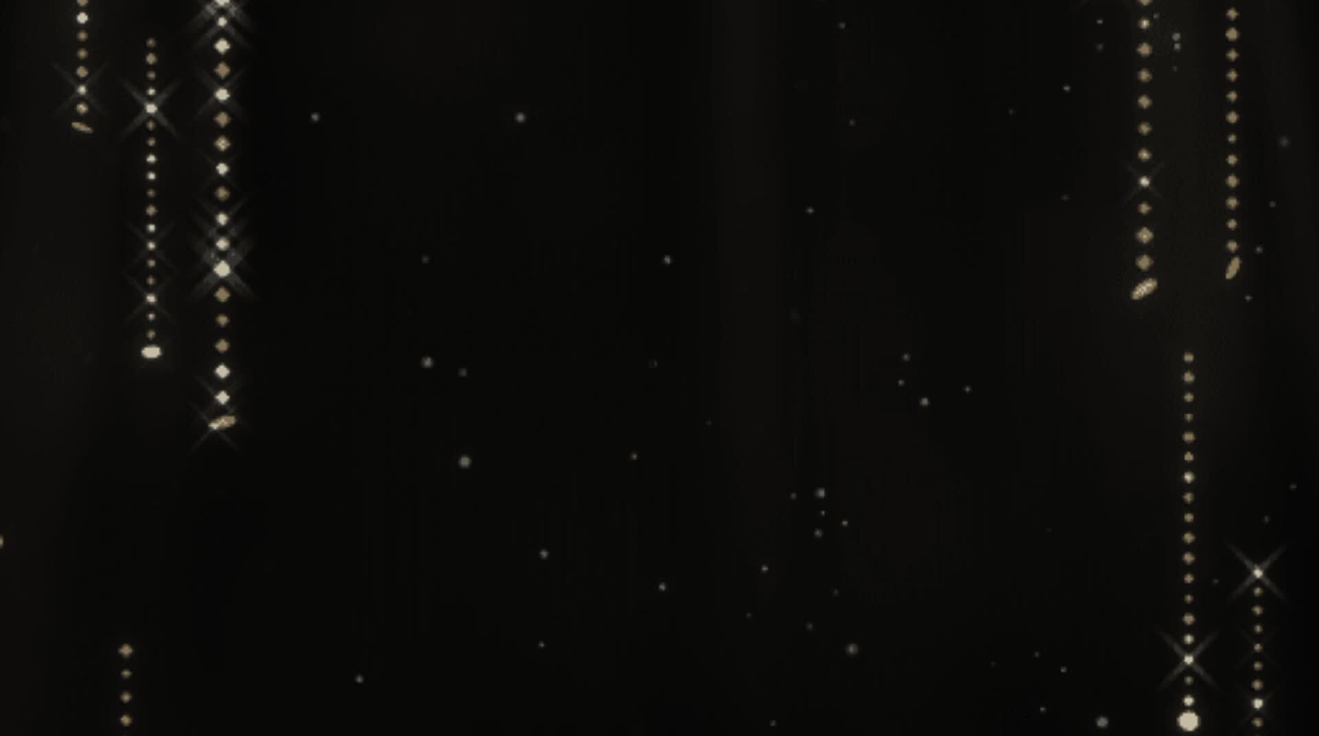 On Black Background Floating Golden Sparkles Glowing Particles