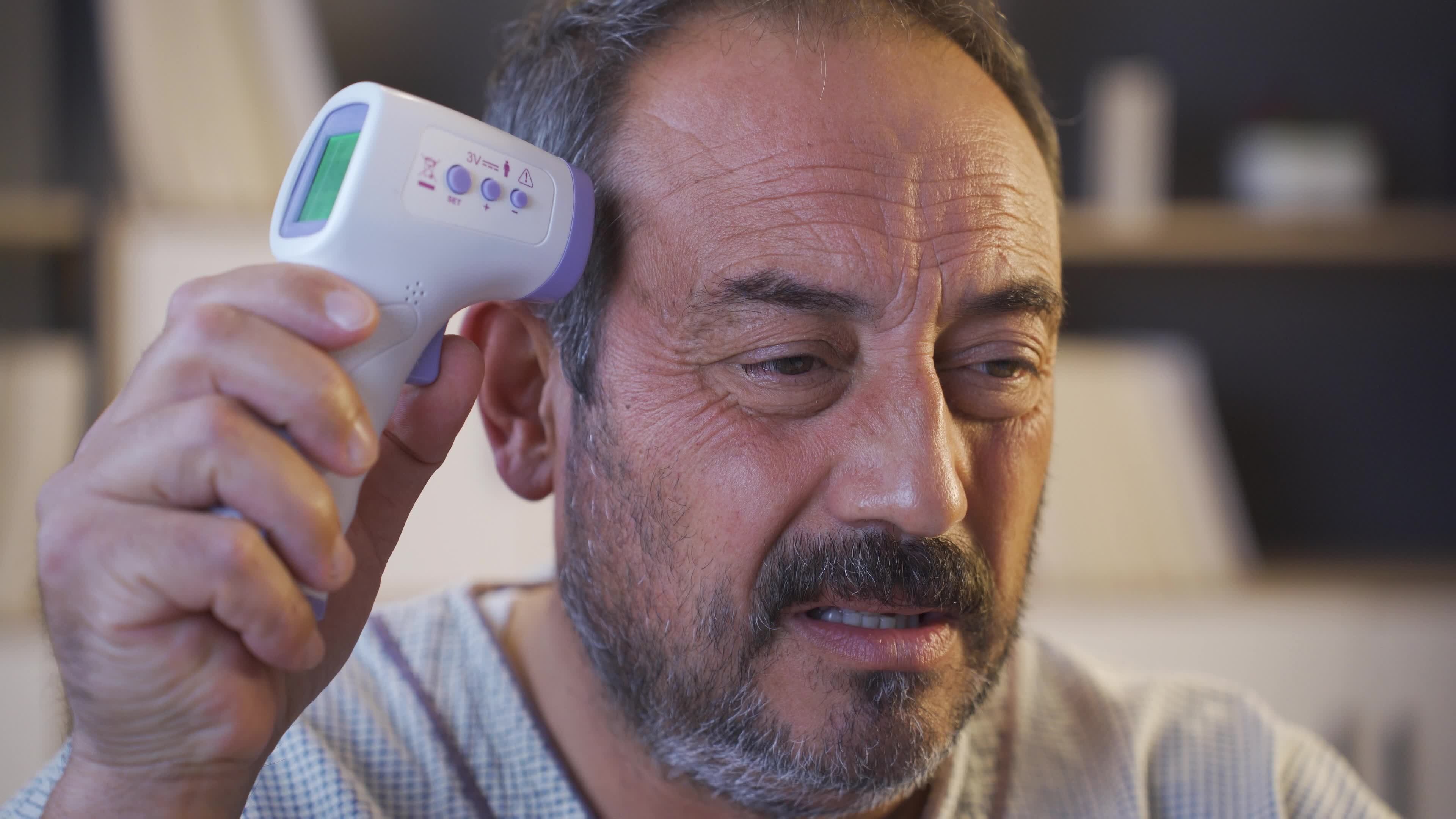 Sick old man takes temperature. 44635103 Stock Video at Vecteezy Sick old man takes temperature. 44635103 Stock Video at Vecteezy