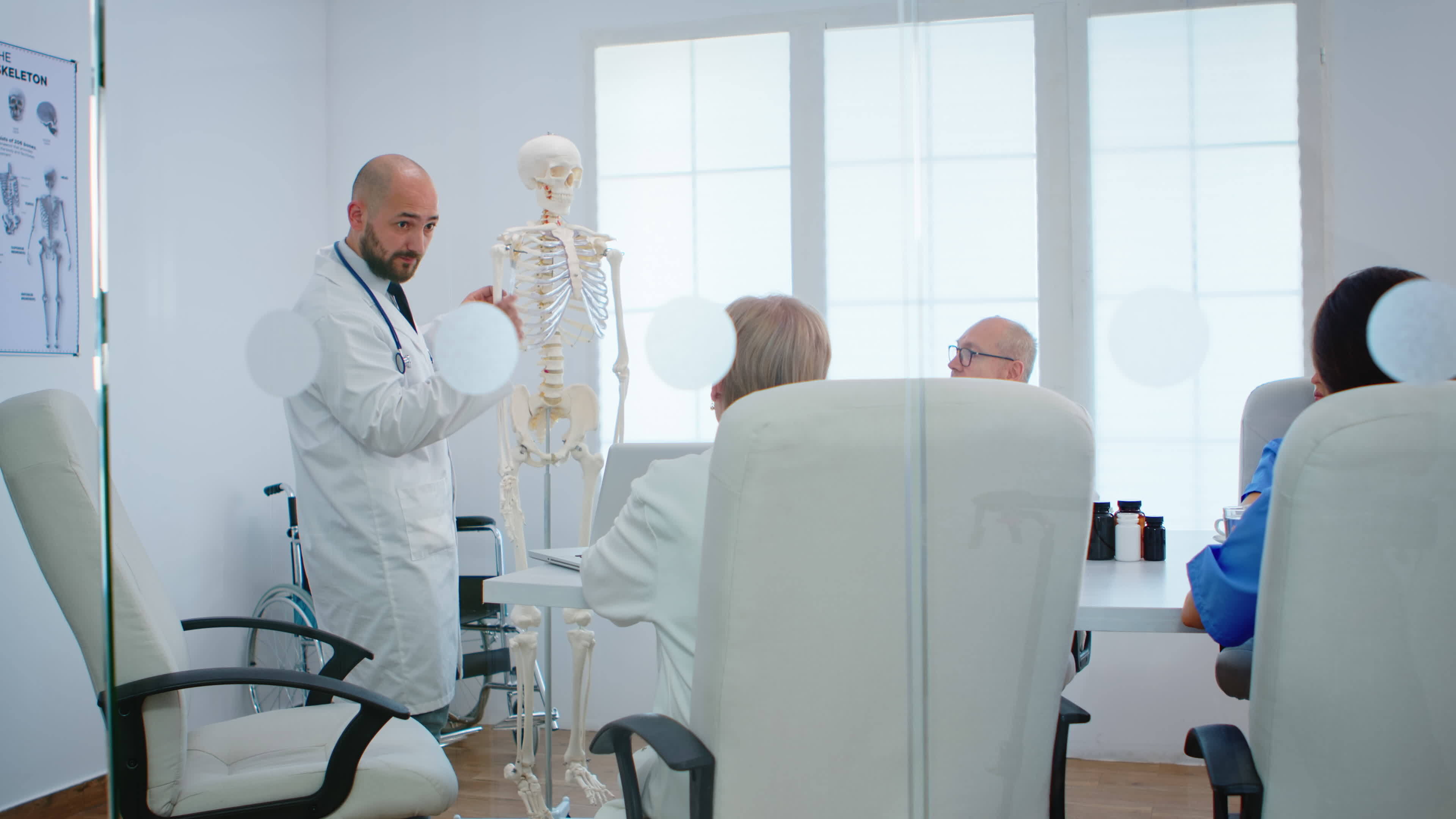 Professional physician learning colleagues body bone functionson using radiography and human ...