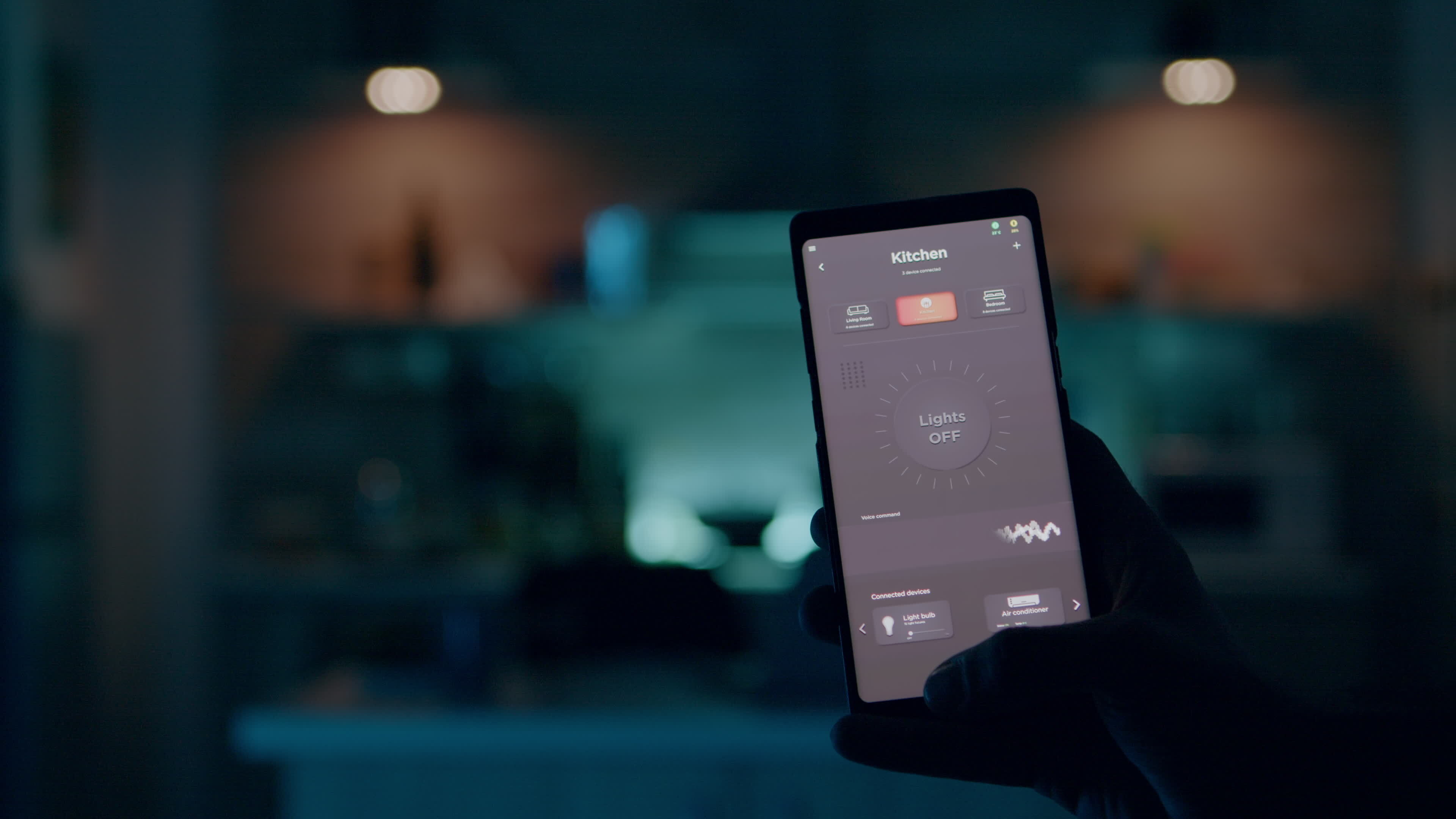 Male working in smart home using mobile phone with lighting control app ...