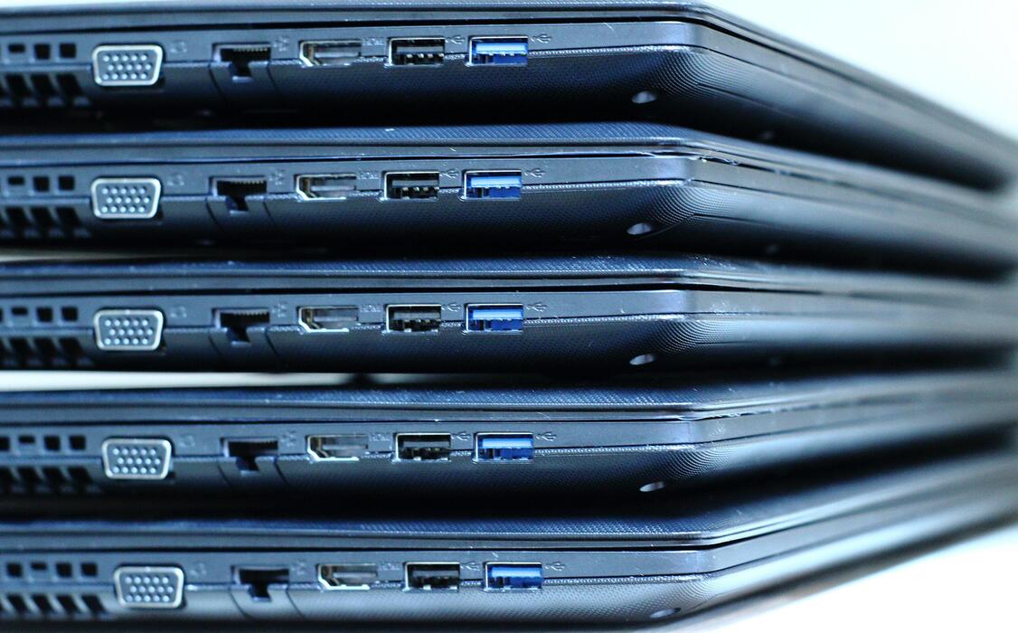 Stack Of Laptops Stock Photos, Images and Backgrounds for Free Download