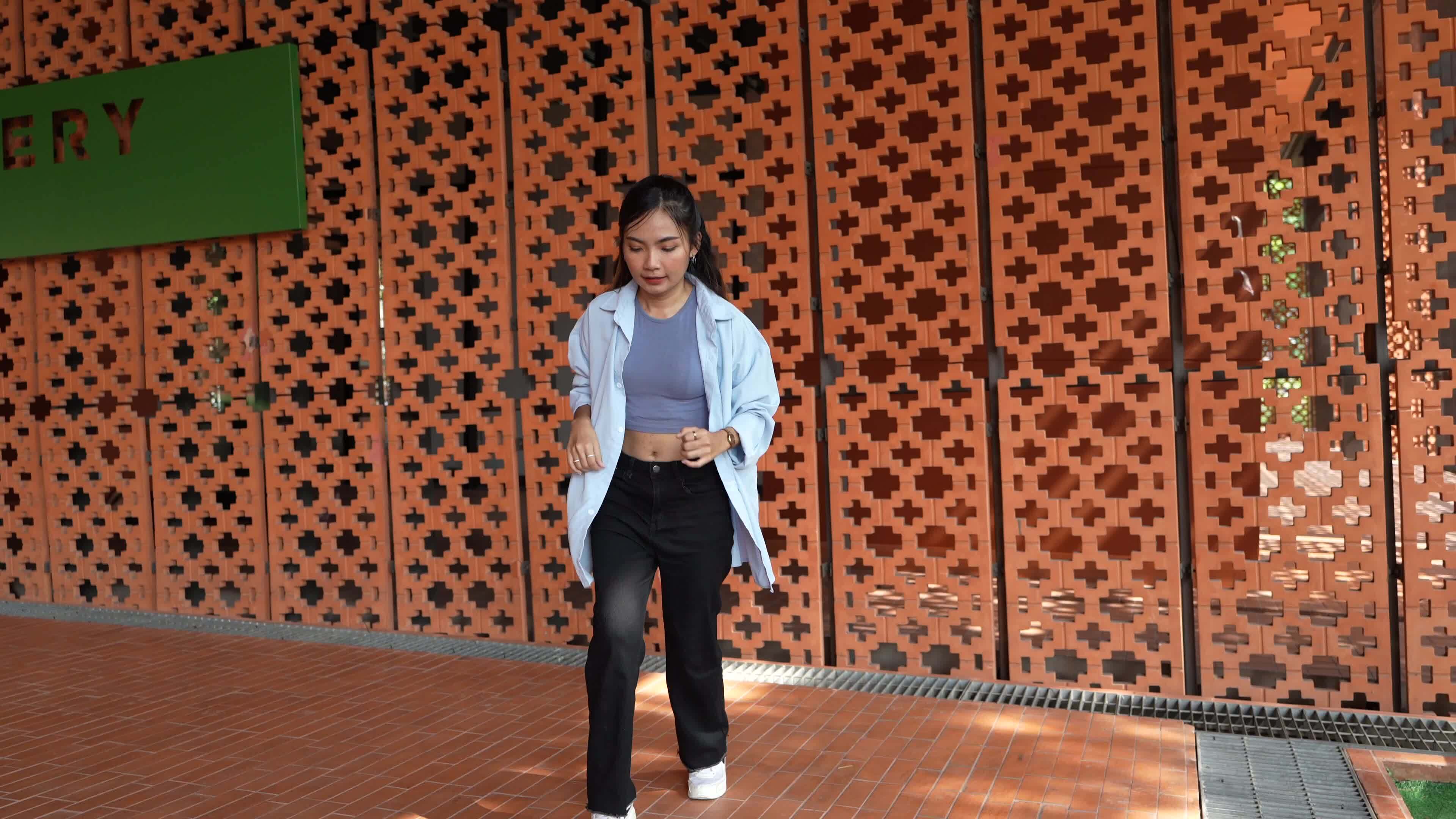 Young Asian woman walking and dancing in the city. Style. Hip hop and freestyle. 45679558 Stock ...