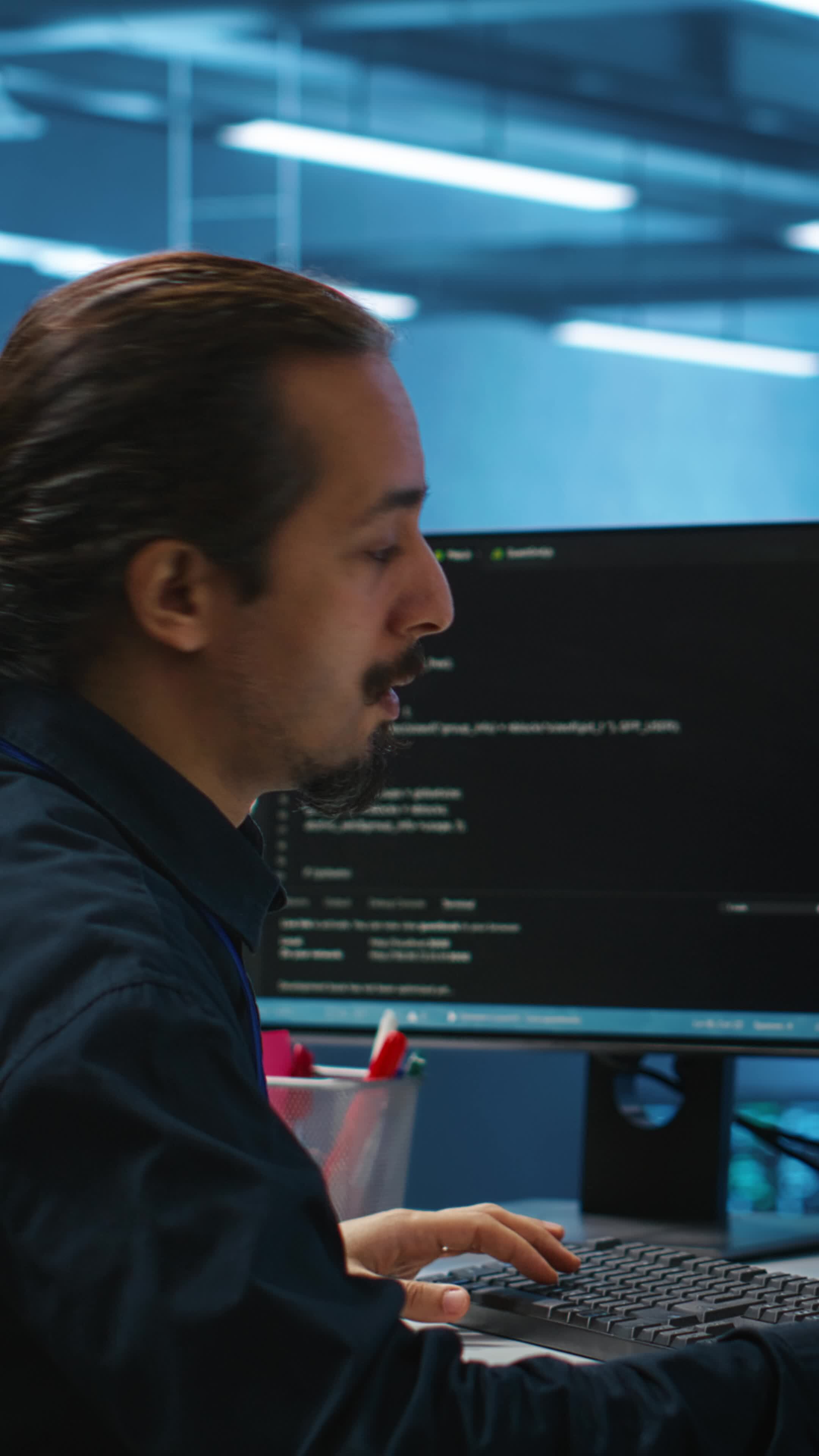 Vertical Engineers coding together in high tech server hub, using ... Vertical Engineers coding together in high tech server hub, using ...