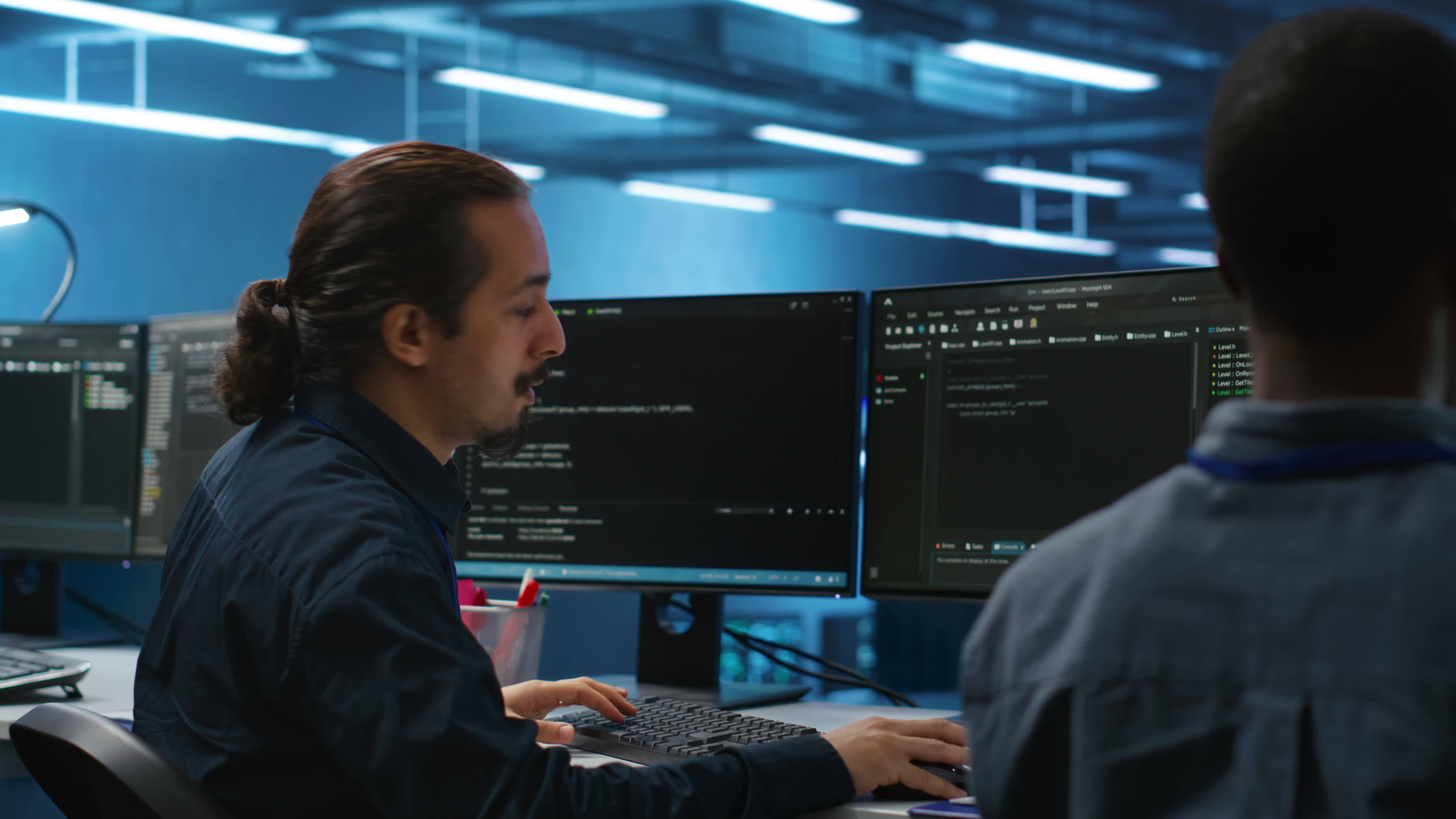 Engineers Coding Together In High Tech Server Hub Using Computers To 7174