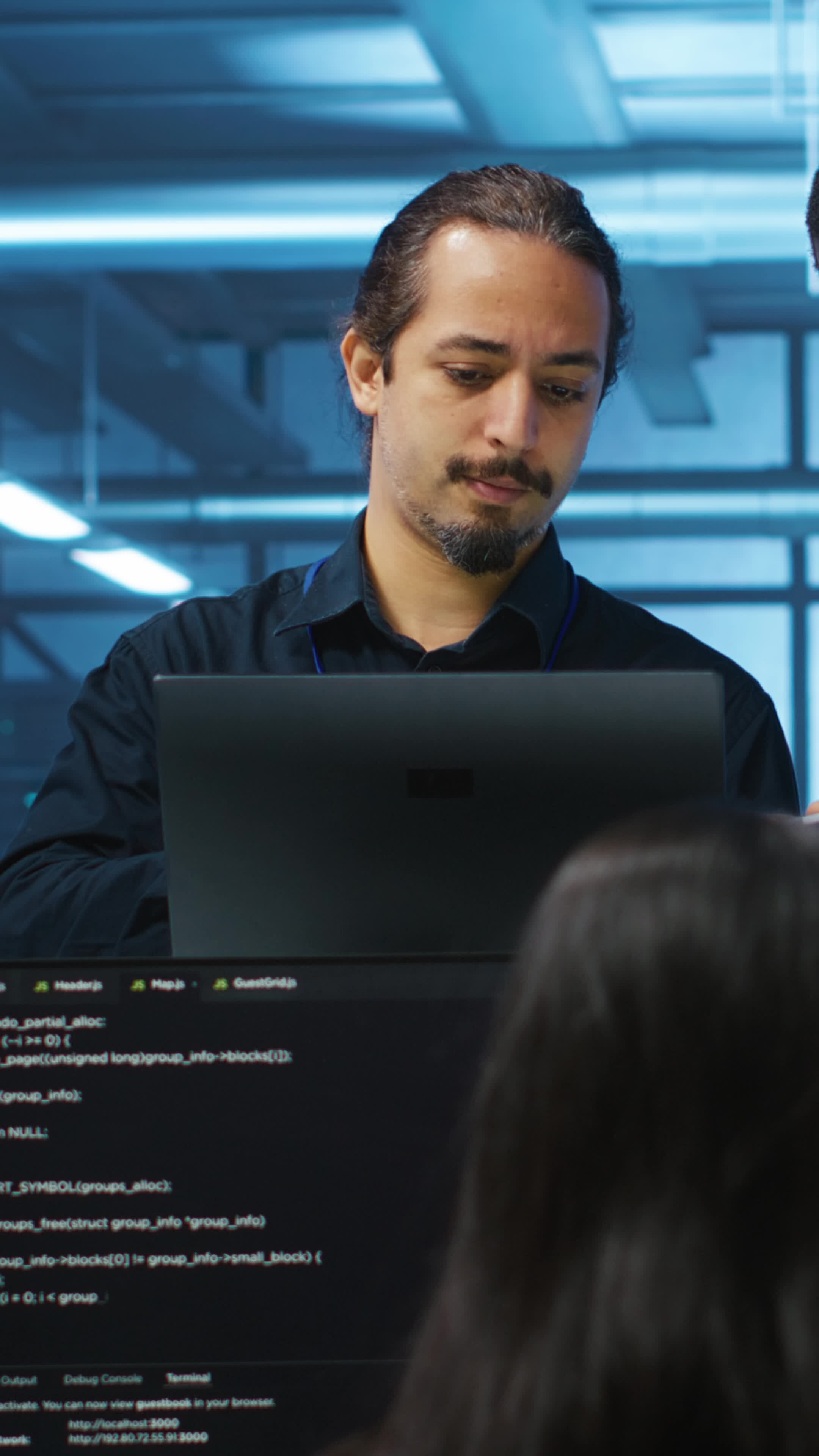 Vertical Multiethnic Coworkers In Server Room Collaborating To Fix Servers Providing Computing