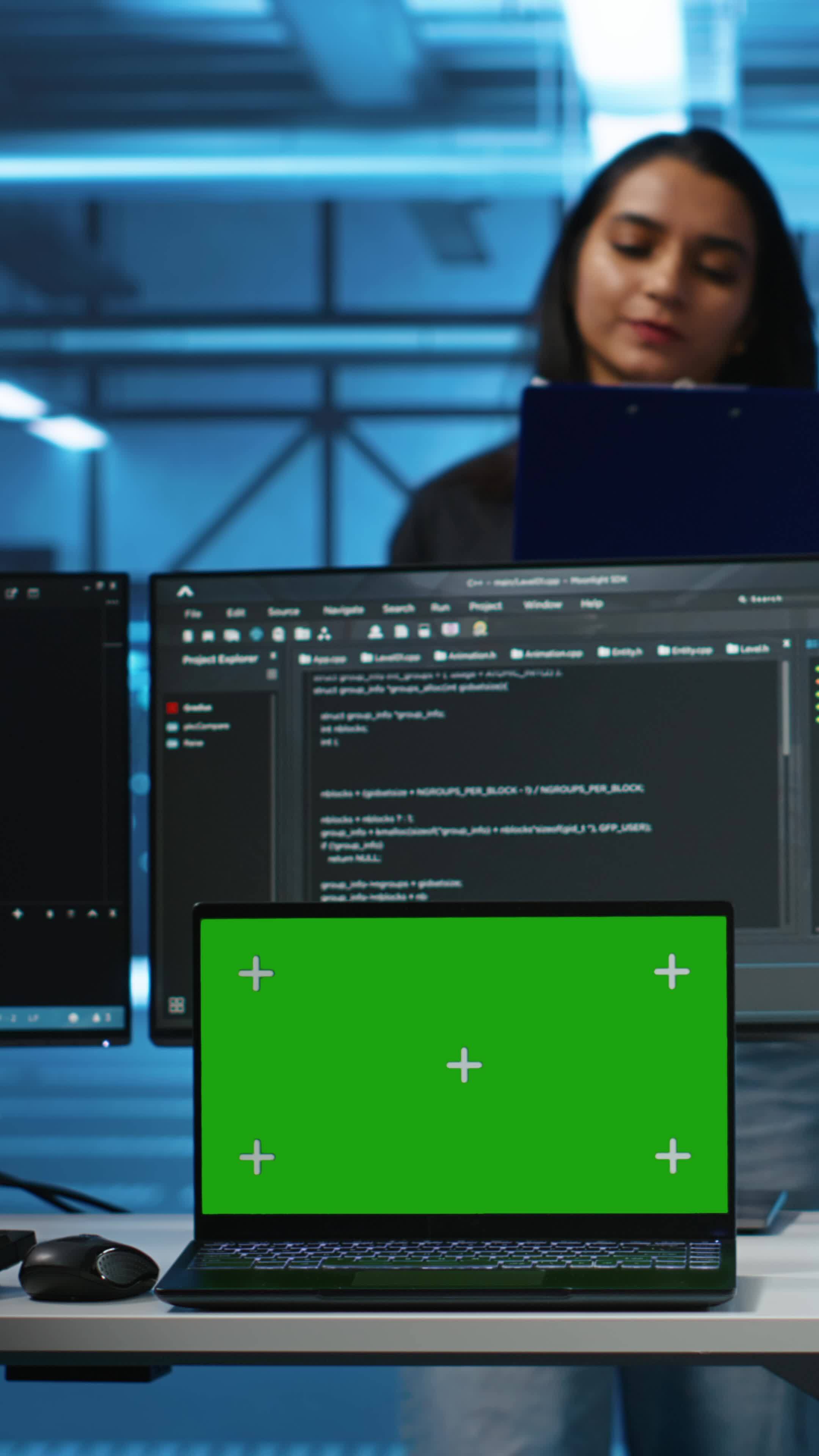 Vertical Green Screen Laptop In Data Center In Front Of Manager And It Support Specialists