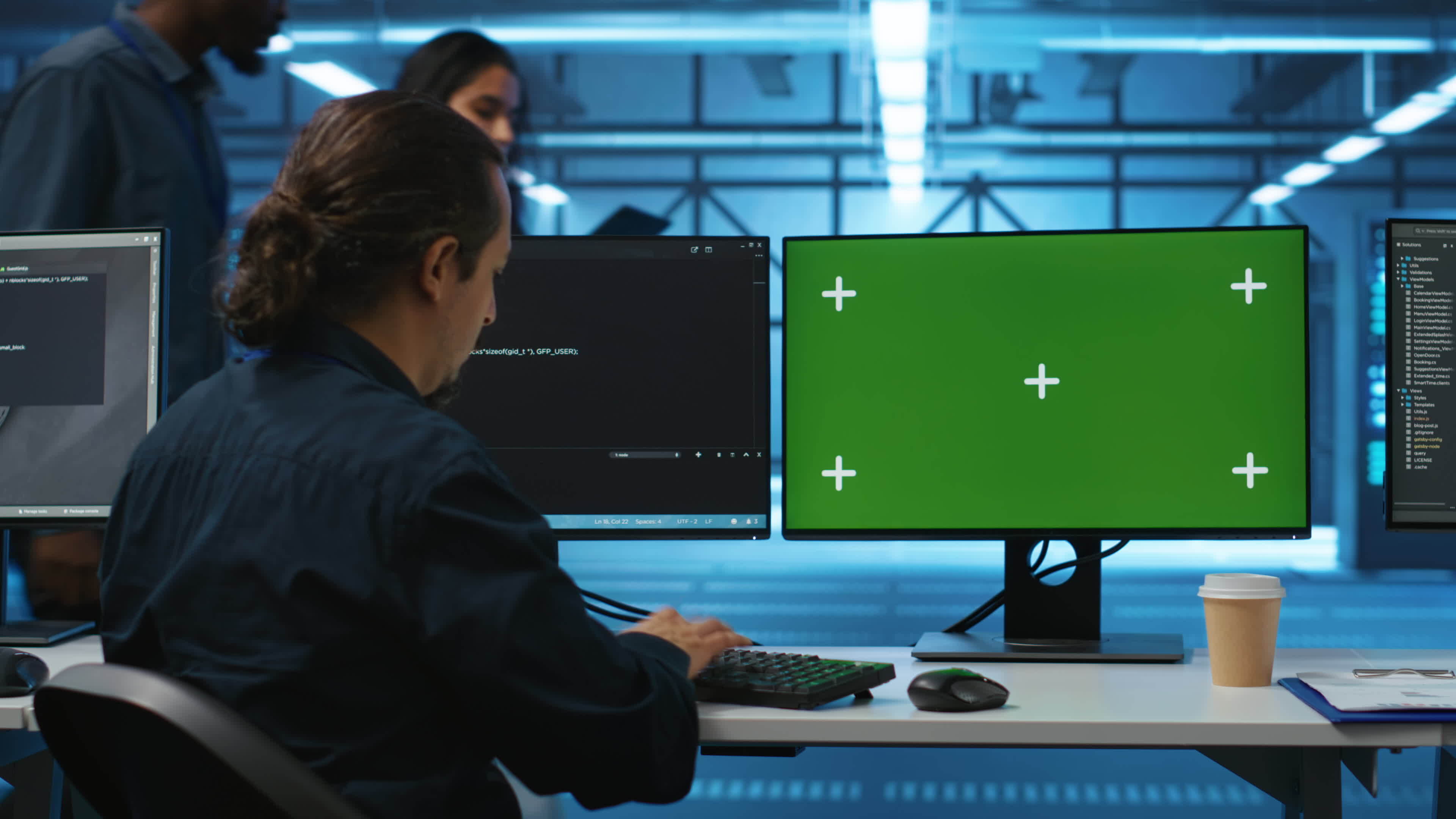 Engineer in server hub using green screen PC to repair equipment ... Engineer in server hub using green screen PC to repair equipment ...
