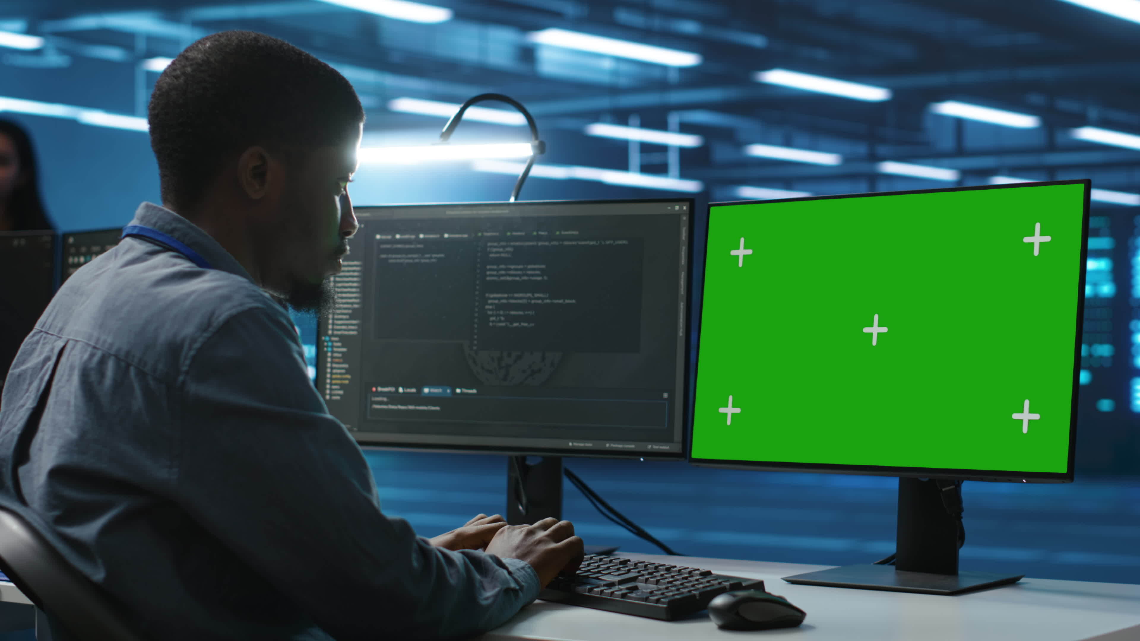 Employee Working On Green Screen Computer In Server Hub Capable Of Processing Vast Amounts Of