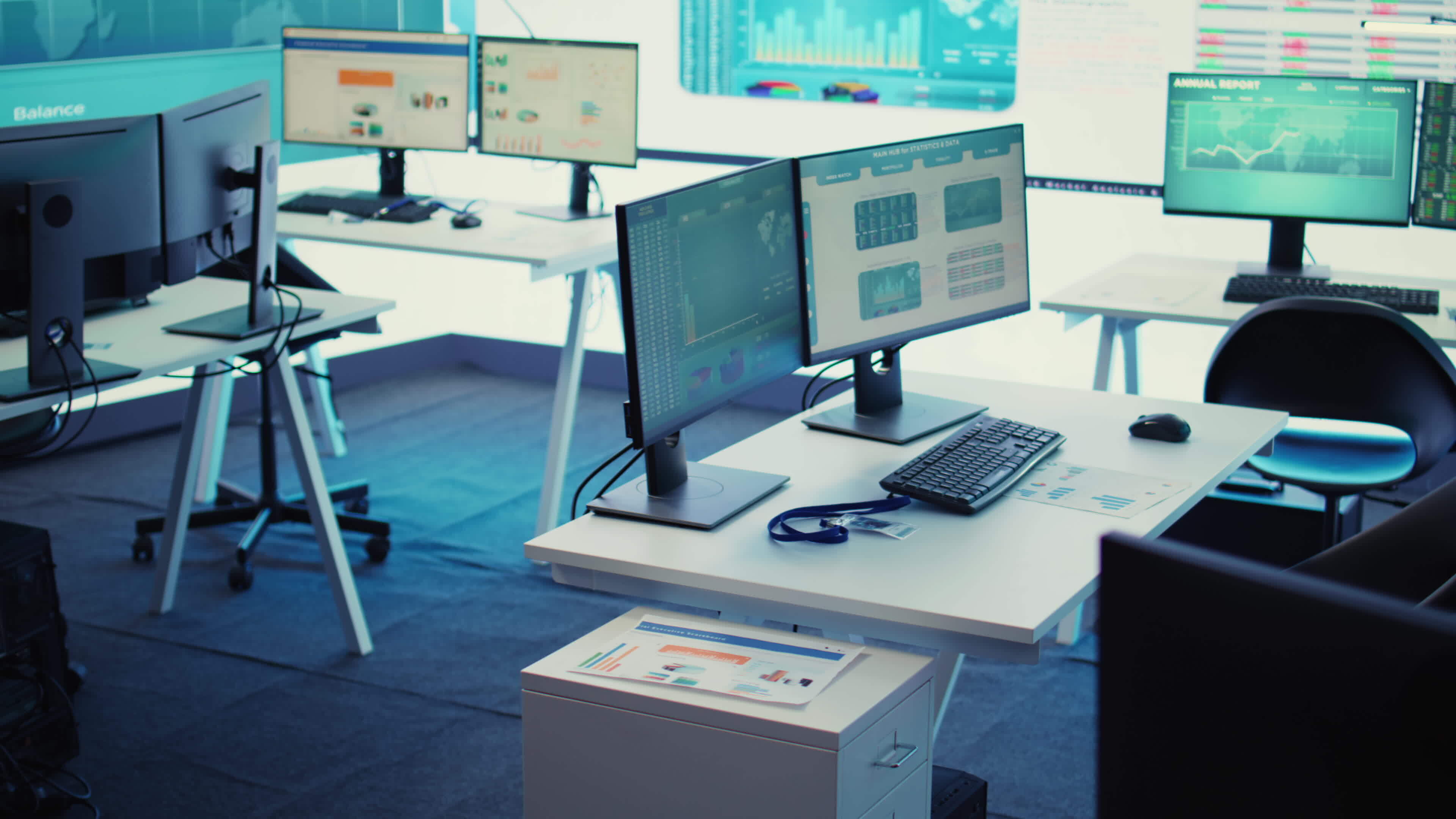 Empty telecommunications control room with workstations, coworking ...