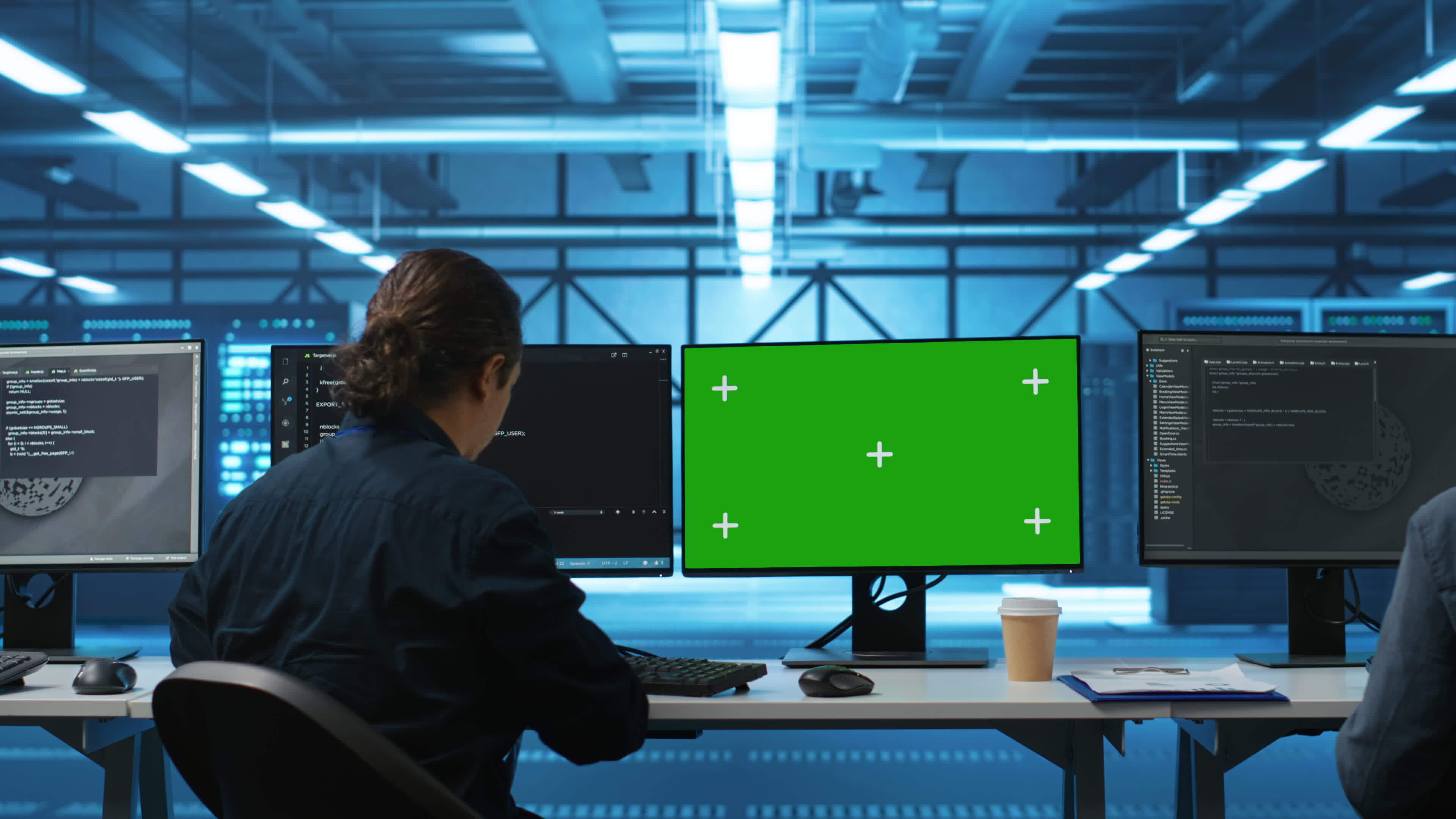 It Support Workers In Data Center Coding On Green Screen Computers