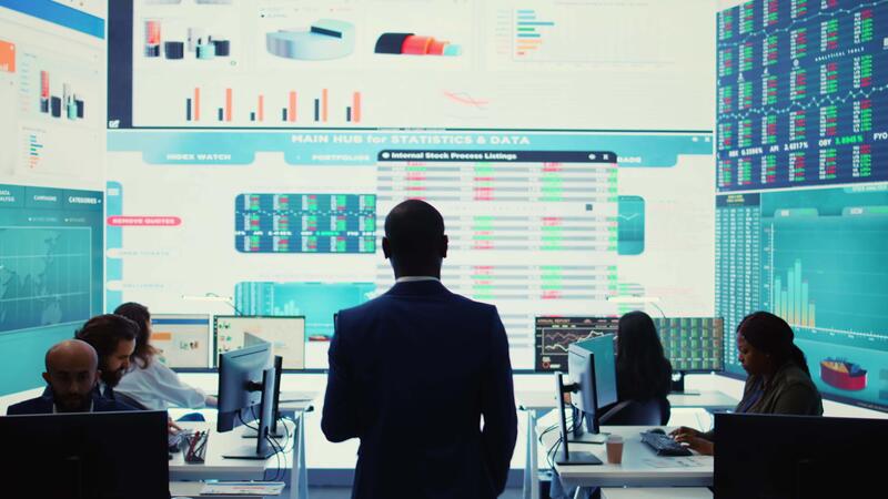 Administrative assistant examining important big data visualizations on ...