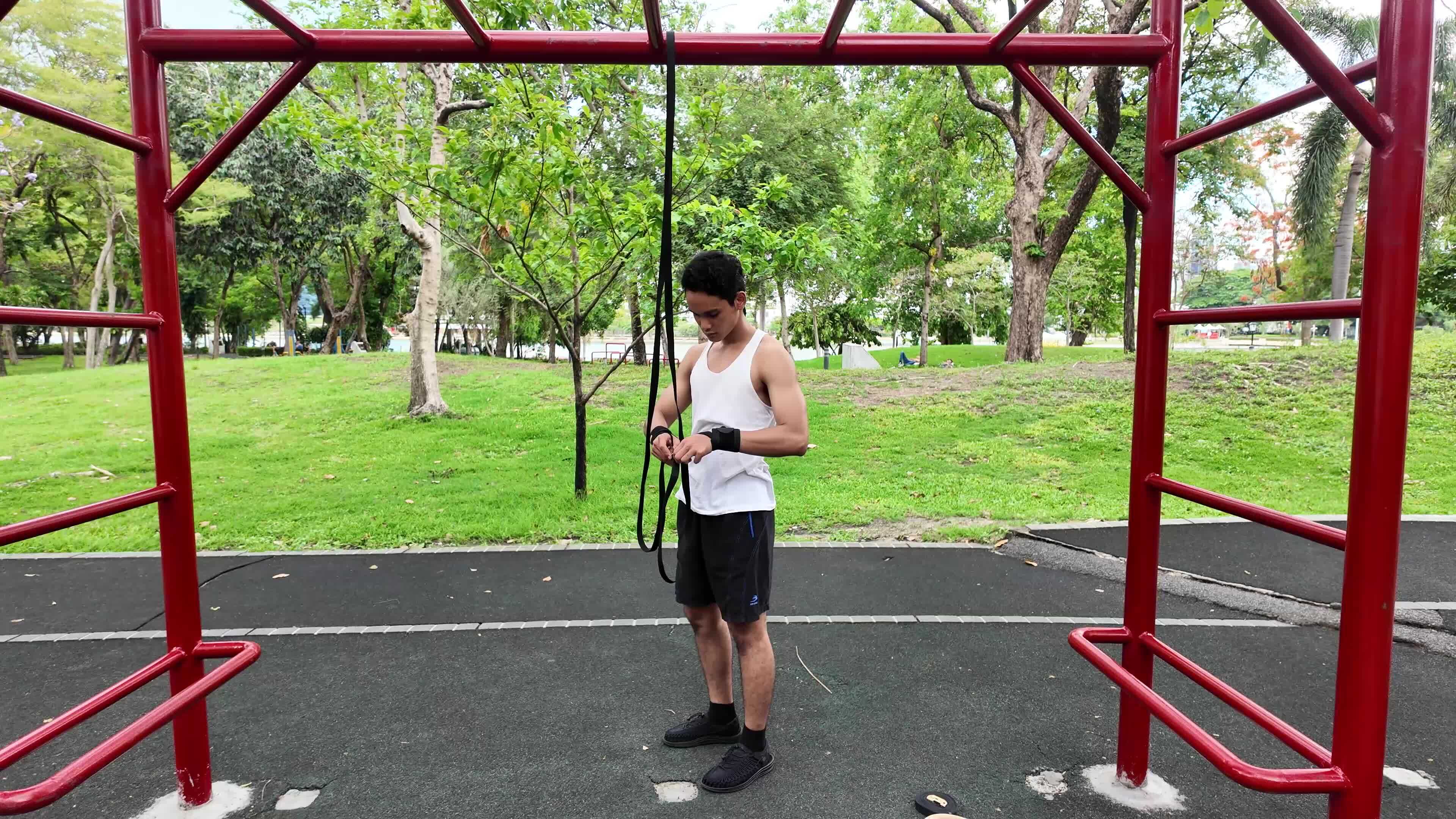 Asian Man Practicing Gymnastics Doing Gymnastics Bar And Hoop Exercises And Stretching And