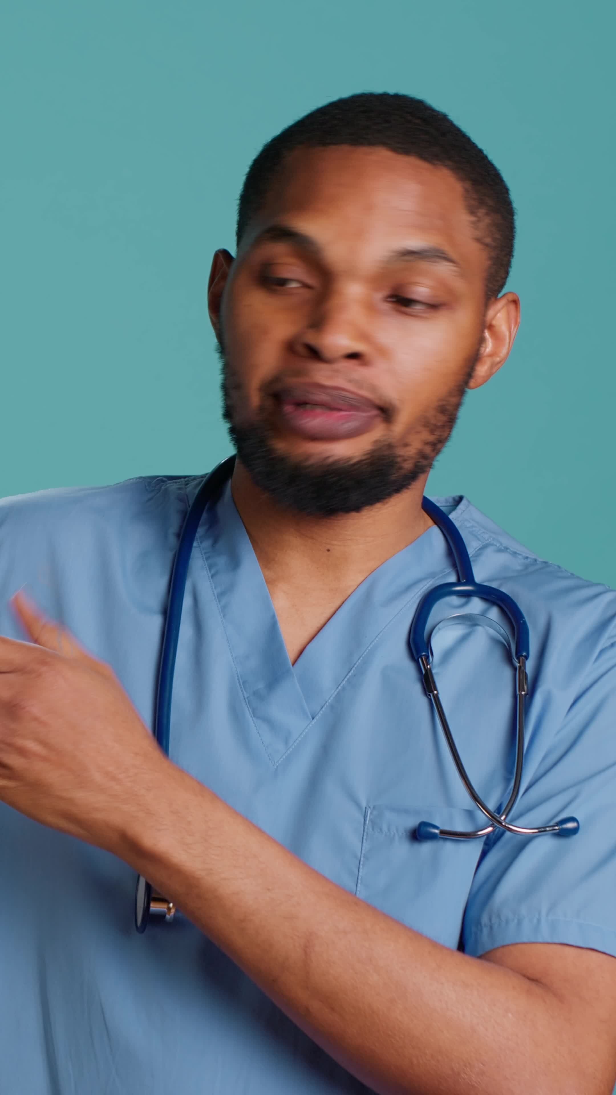 Vertical Male Nurse Holding Iv Bag Preparing To Use It To Administer Fluids Medications And