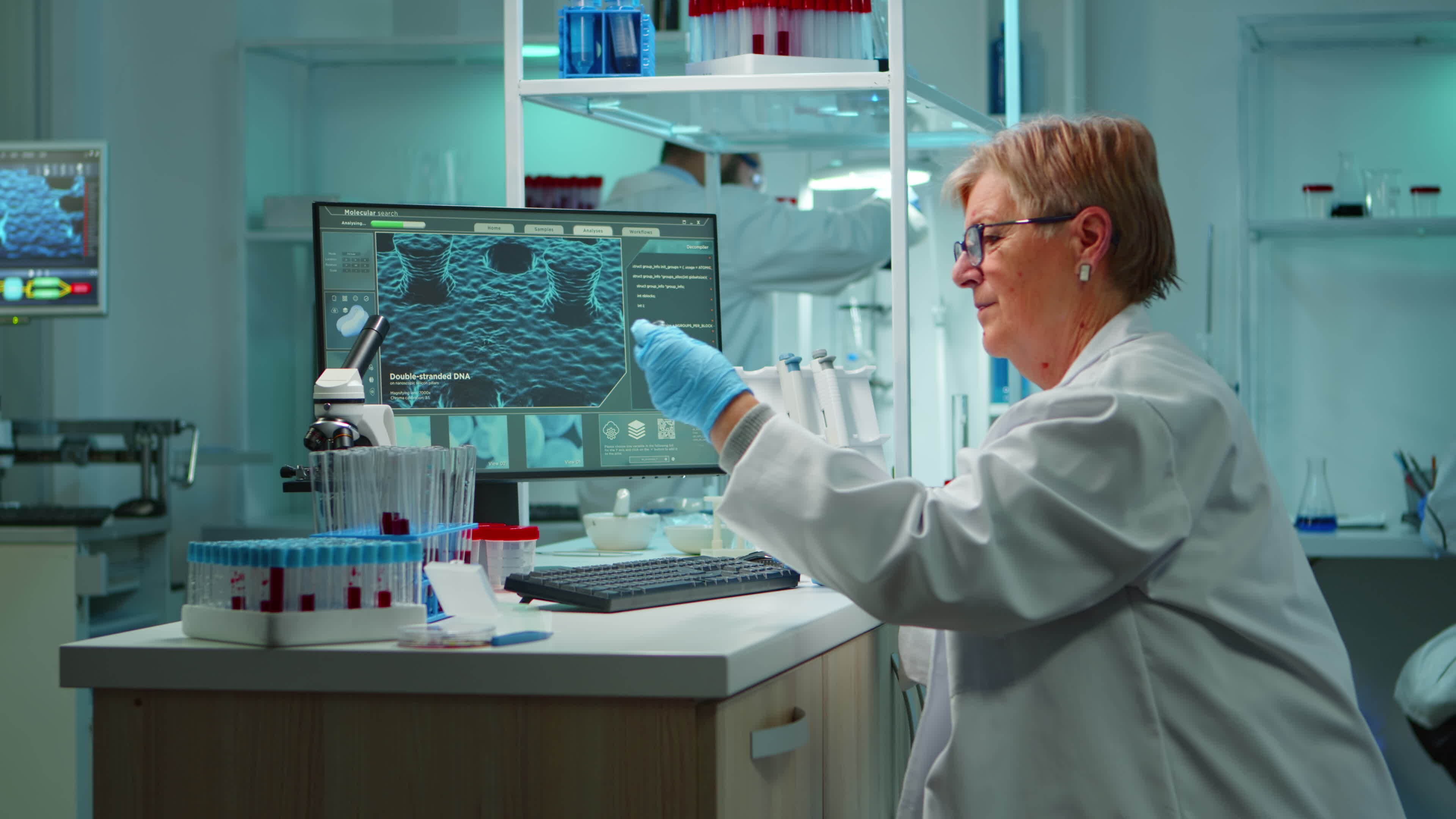Medical Research Scientist Typing Codes On Pc In Biological Applied