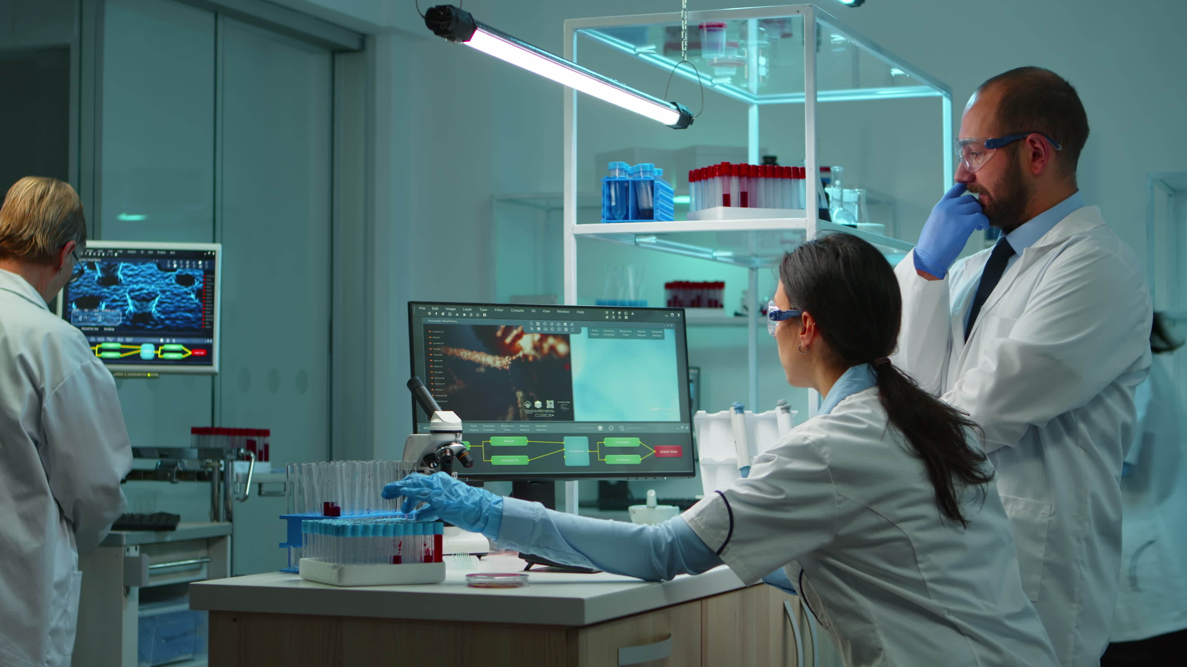 Research scientists working on pc with medical equipment analyzing ...