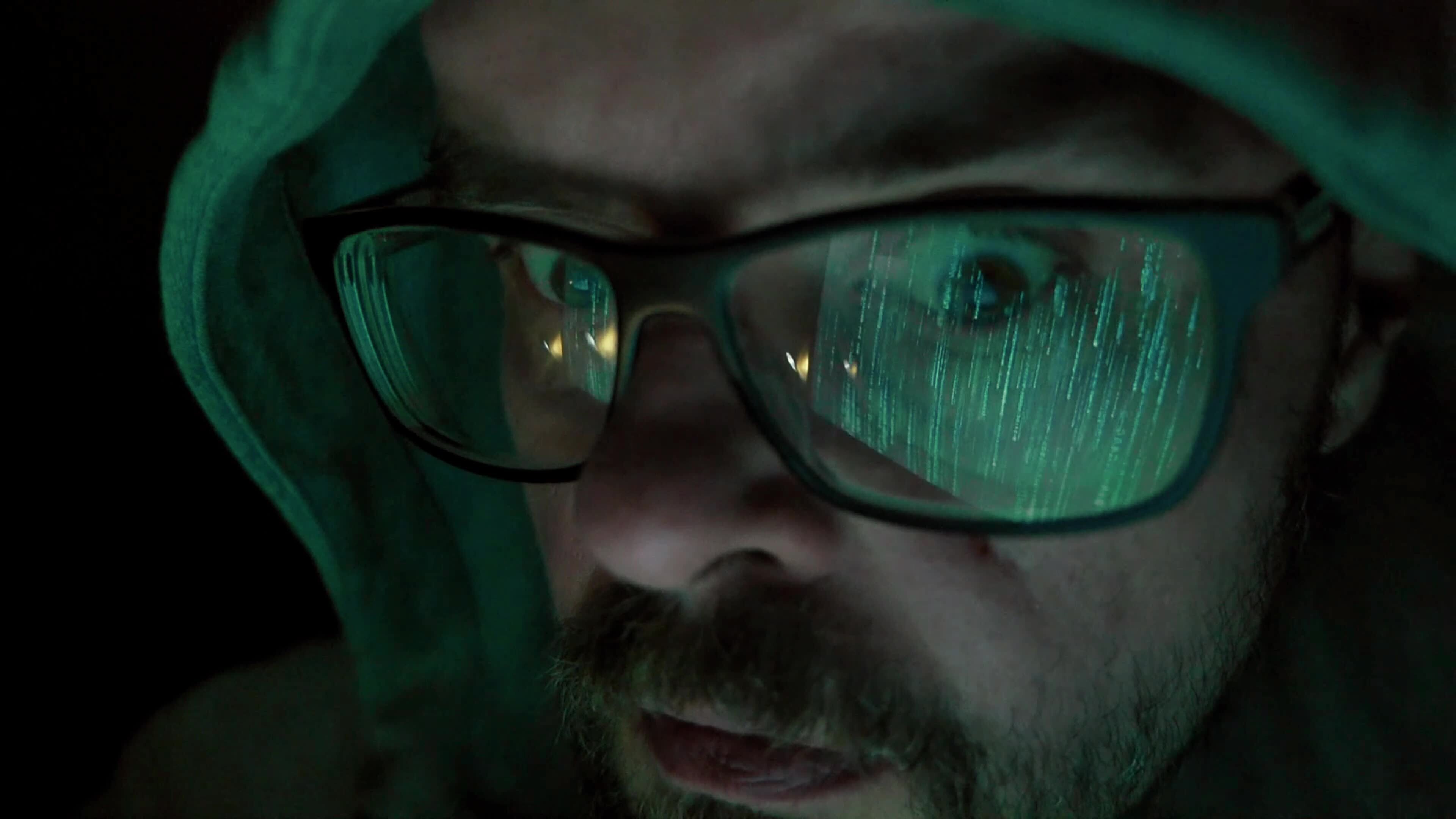 Hacker In Hoody With Beard And Glasses Hacking And Coding At Night