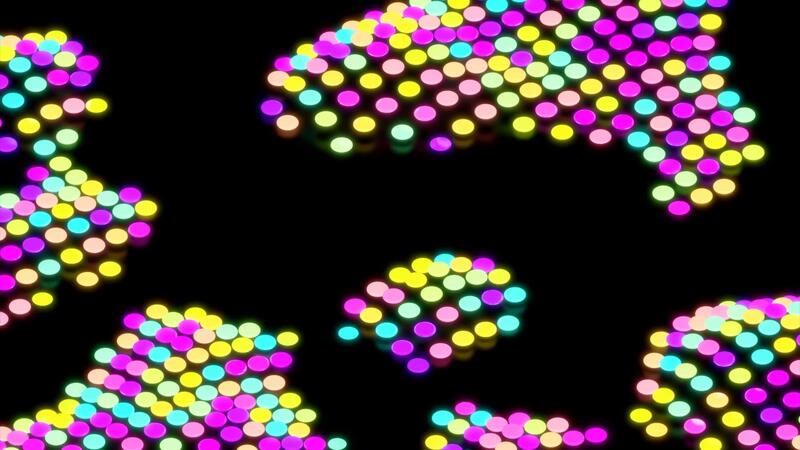 Colorful dots moving in spots on black background. Design. Moving spots ...