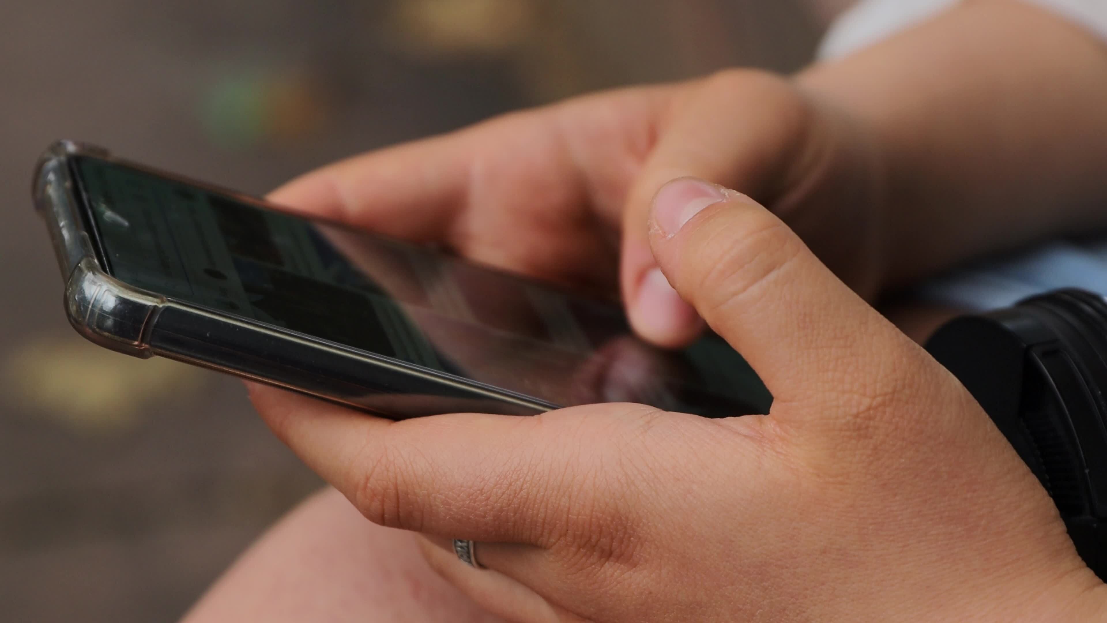 Person Scrolling On Phone Stock Video Footage for Free Download