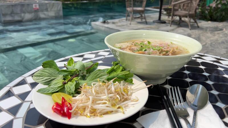 Pho soup Traditional Vietnamese pho soup with greens and chicken sprouted bean sprouts red hot ...
