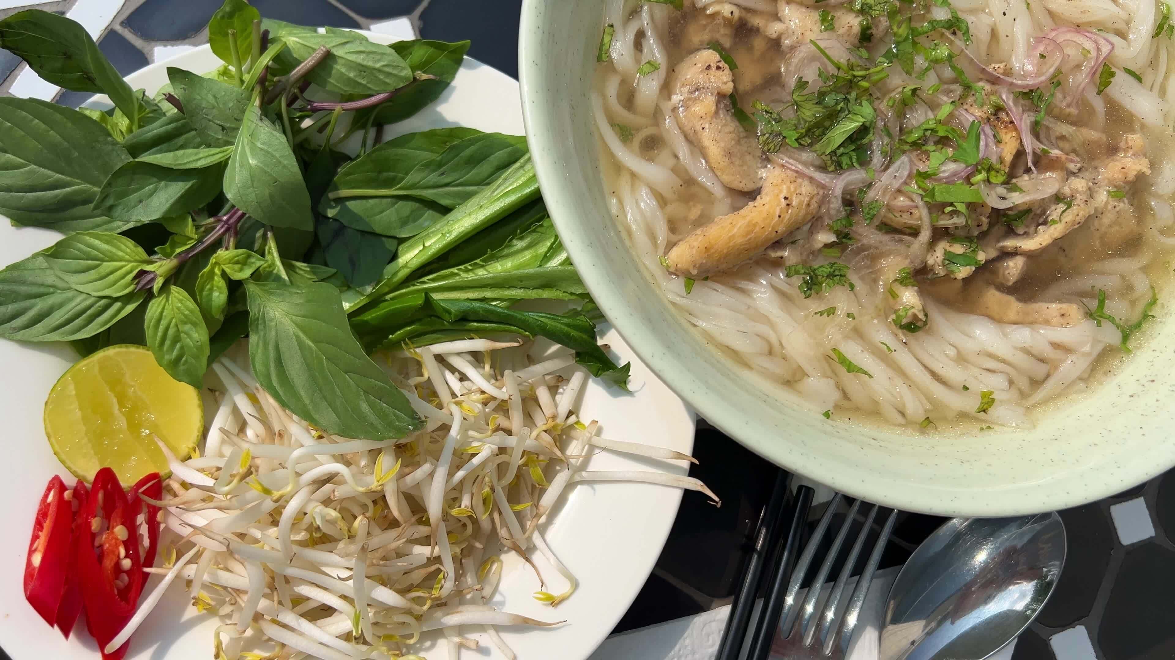 Pho soup Traditional Vietnamese pho soup with greens and chicken sprouted bean sprouts red hot ...