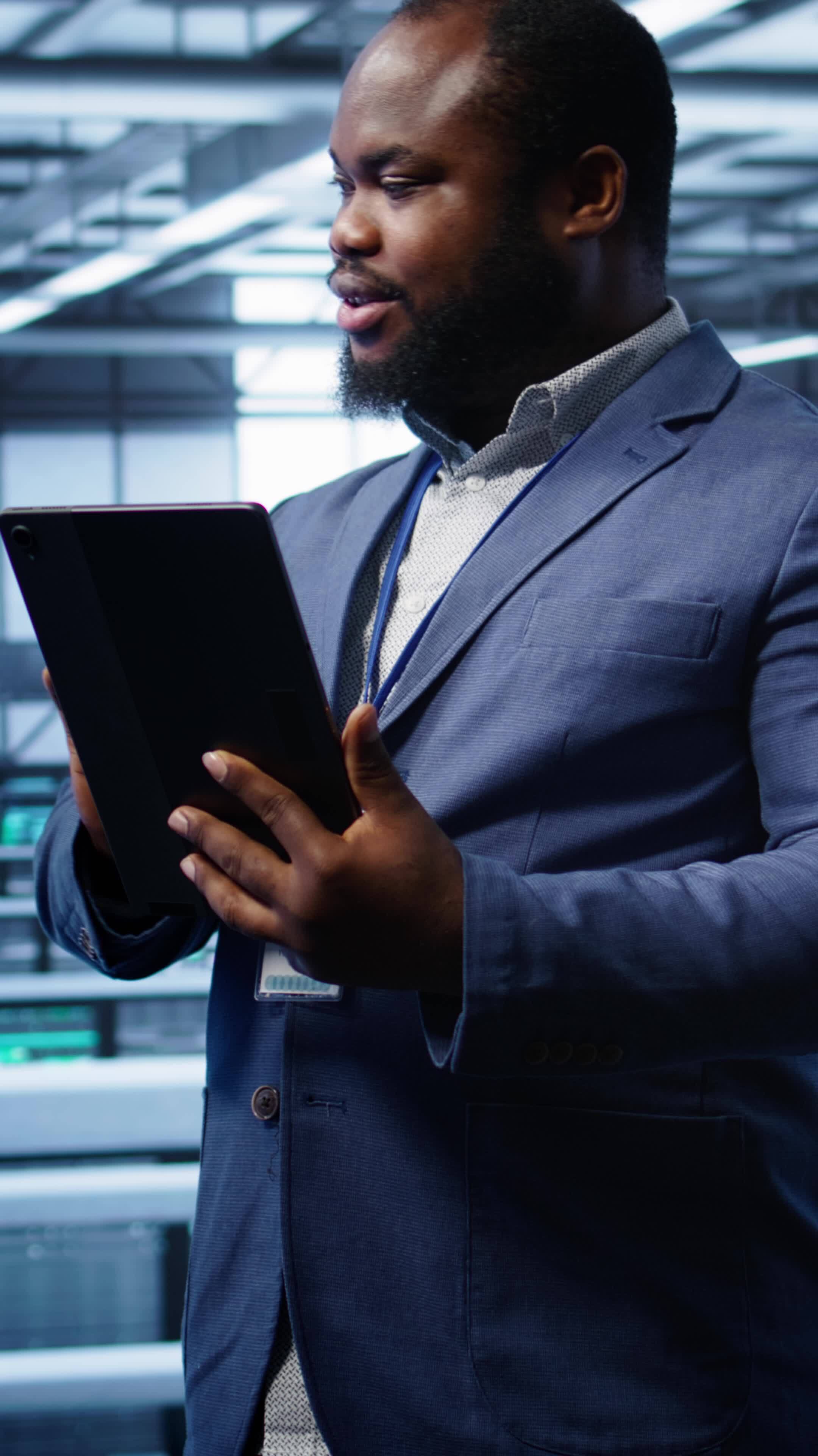 Vertical Programmer In Server Room Location Using Tablet To Patch Network Issues Affecting