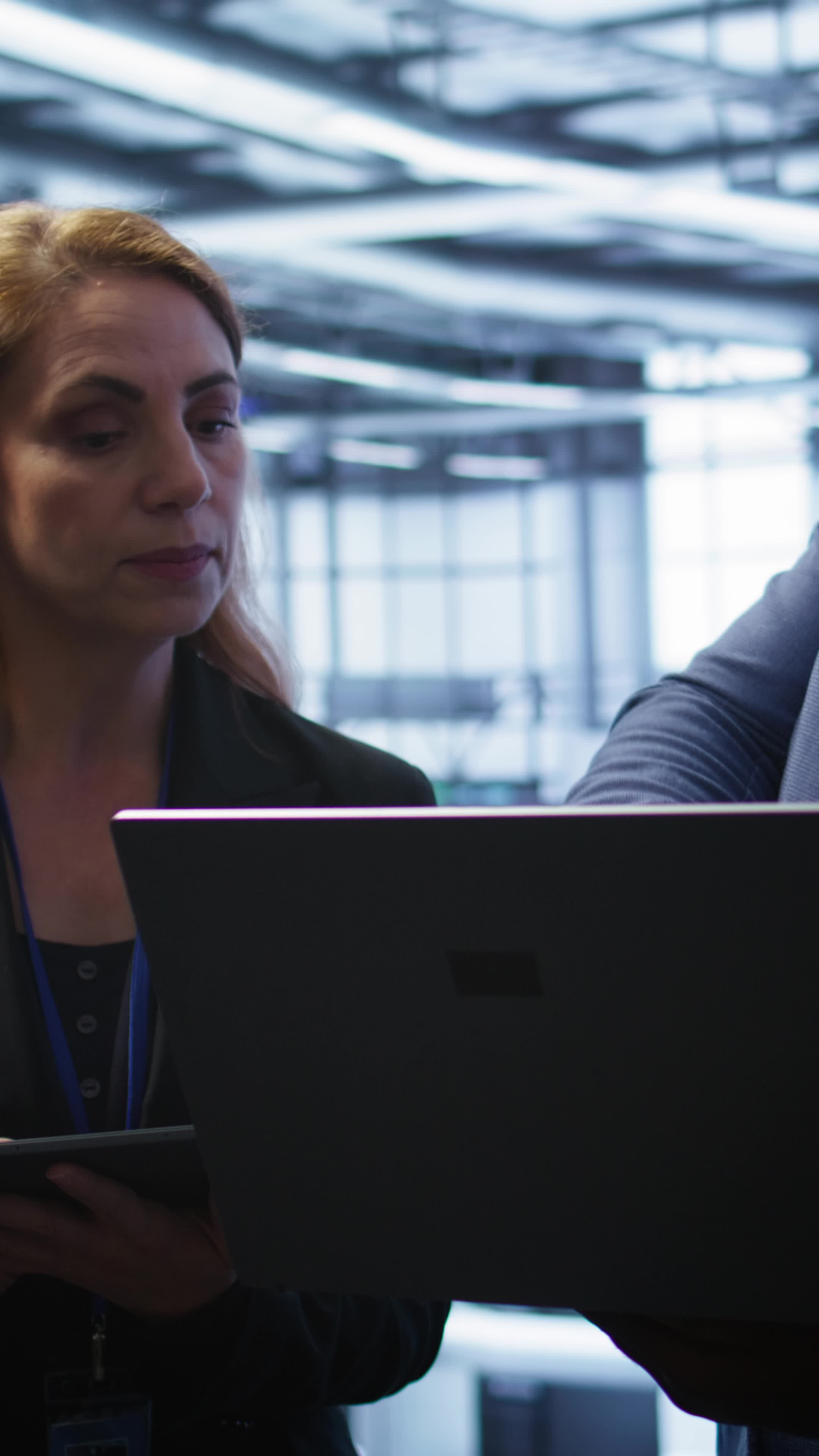 Vertical Team of IT specialists managing data center with advanced ... Vertical Team of IT specialists managing data center with advanced ...