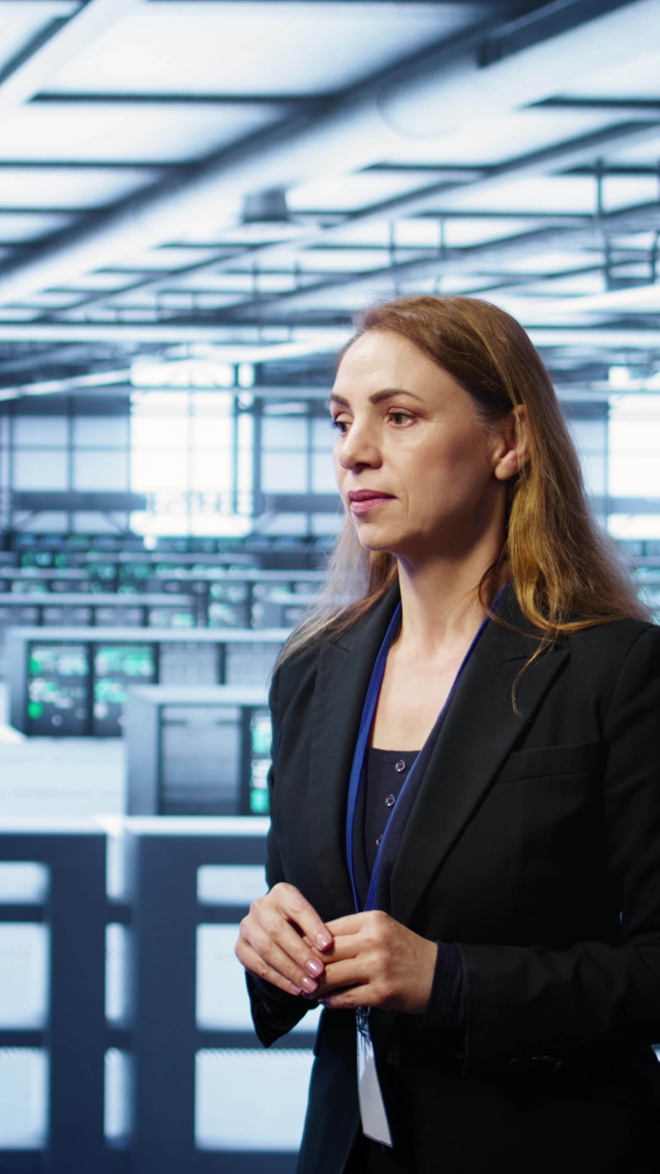 Vertical Software Developer Looking At Holograms In Data Center