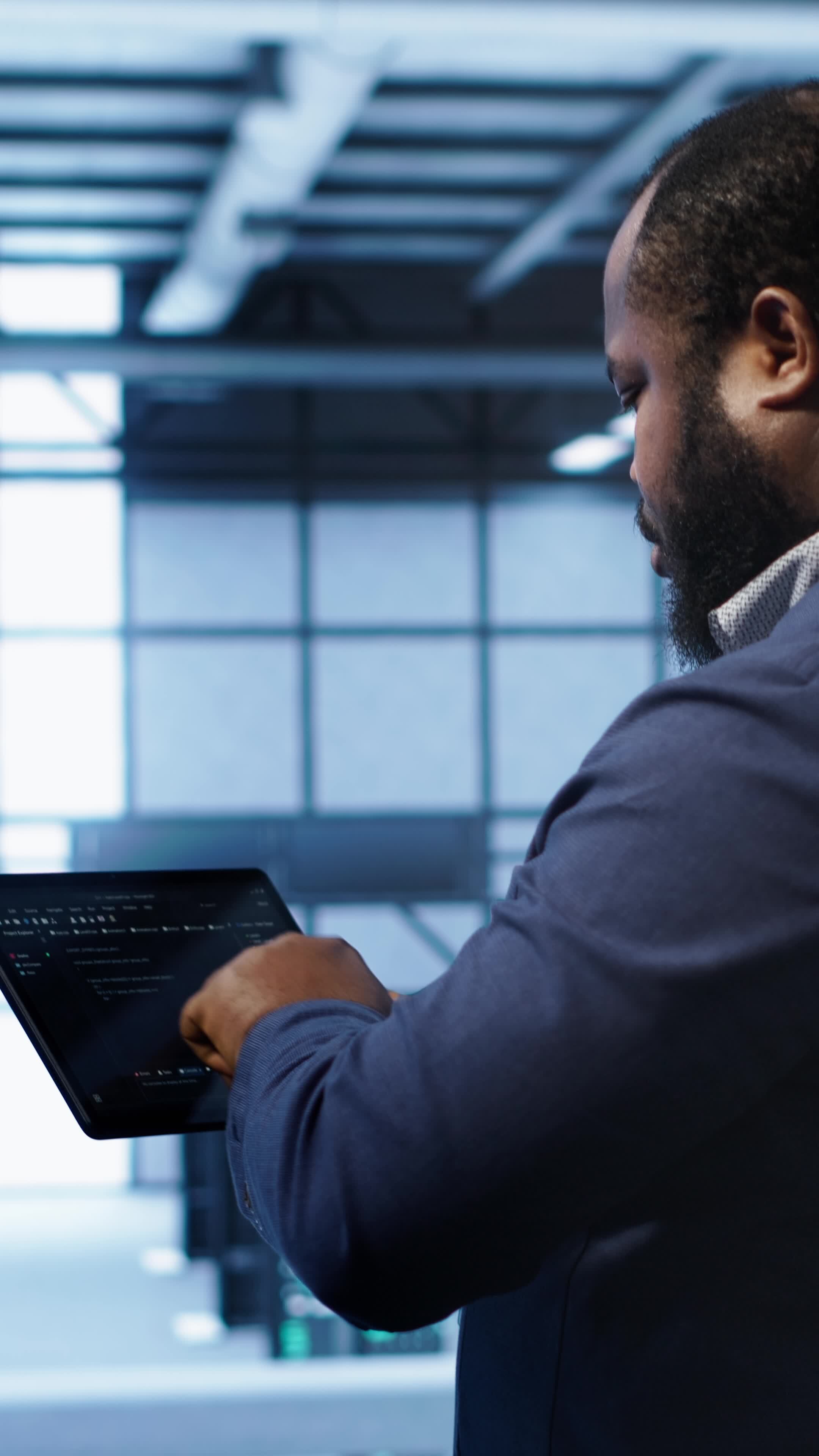 Vertical It Operator In Server Room Workspace Using Tablet To Patch Network Issues Affecting