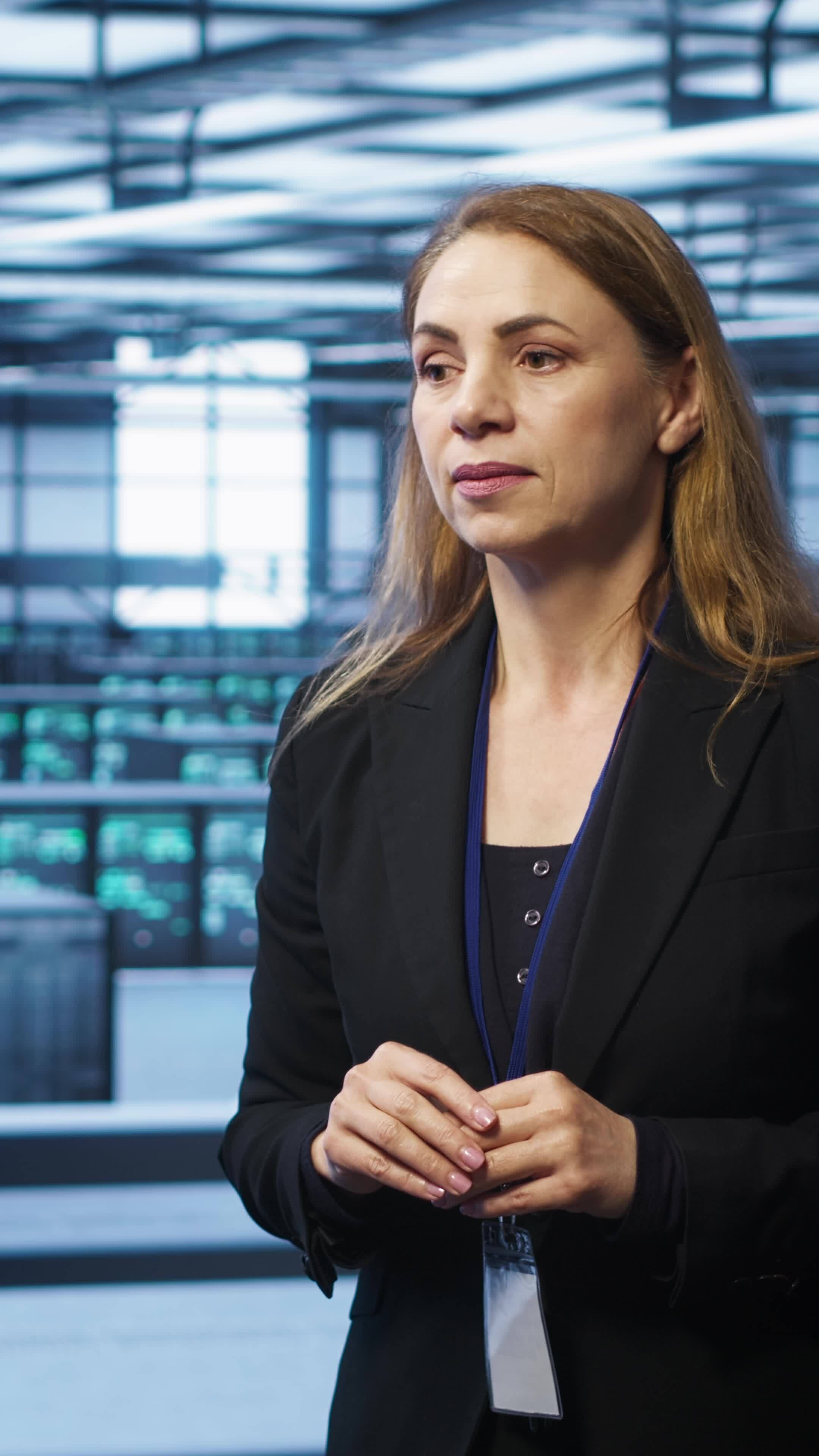 Vertical Software Developer Looking At Holograms In Data Center
