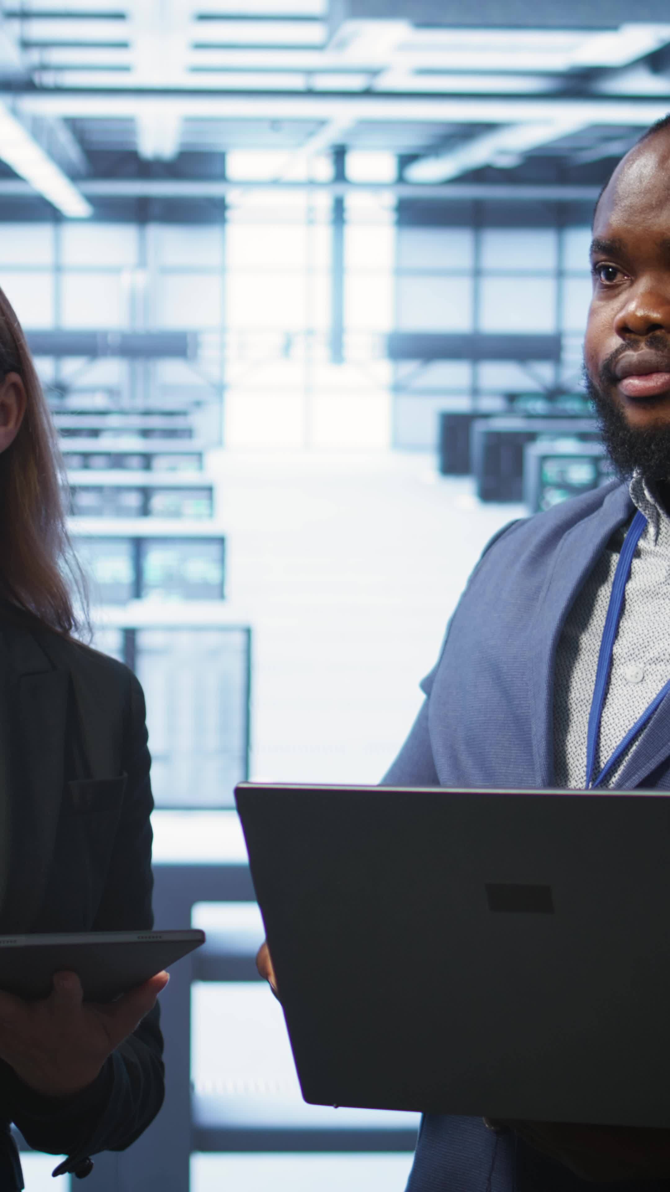 Vertical Teamworking Colleagues Doing Checkup Inputting Data On Laptop Of Needed Server Hub
