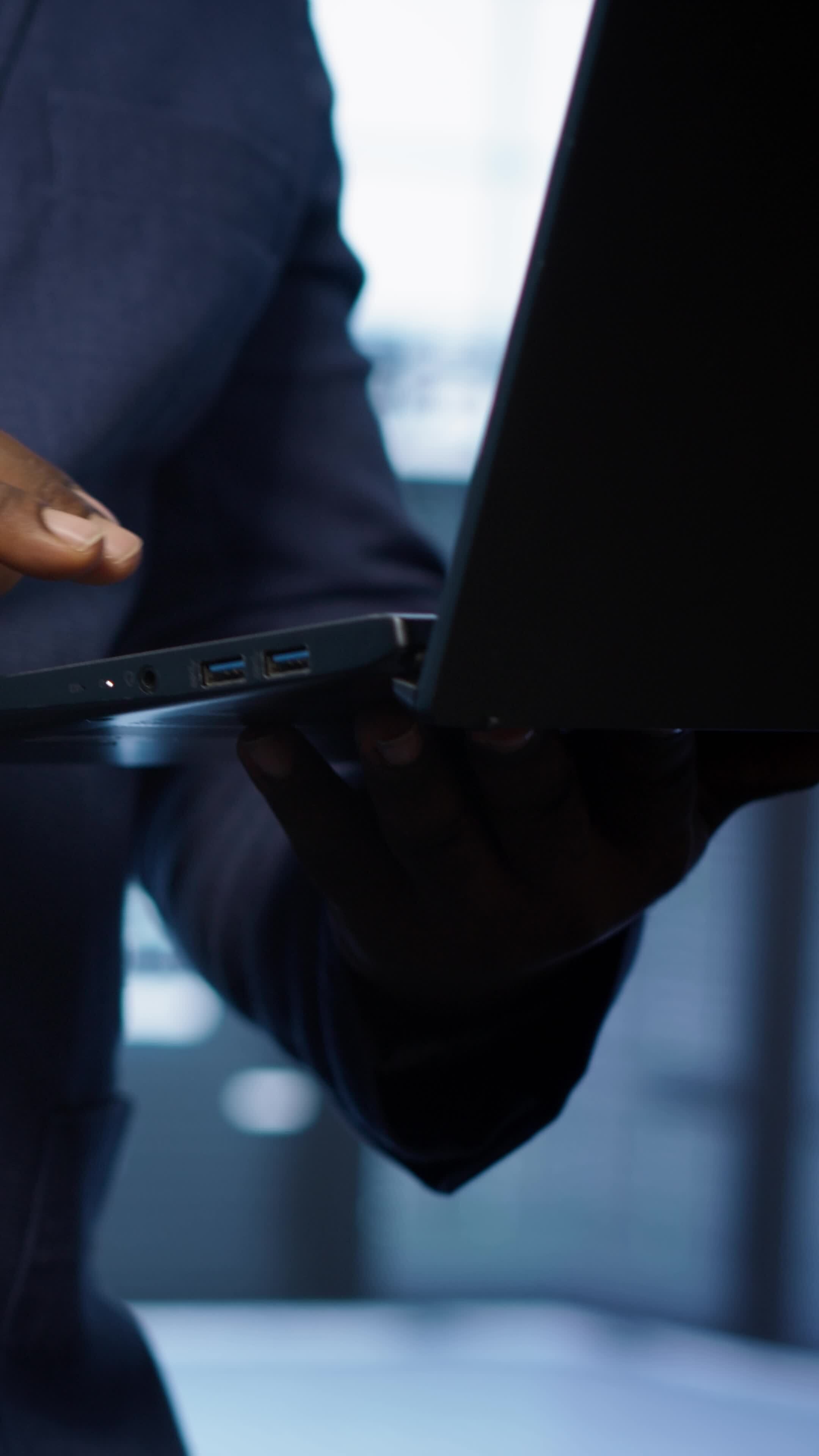 Vertical Technician In Server Hub Using Laptop To Patch Network Issues Leading To Slow Data