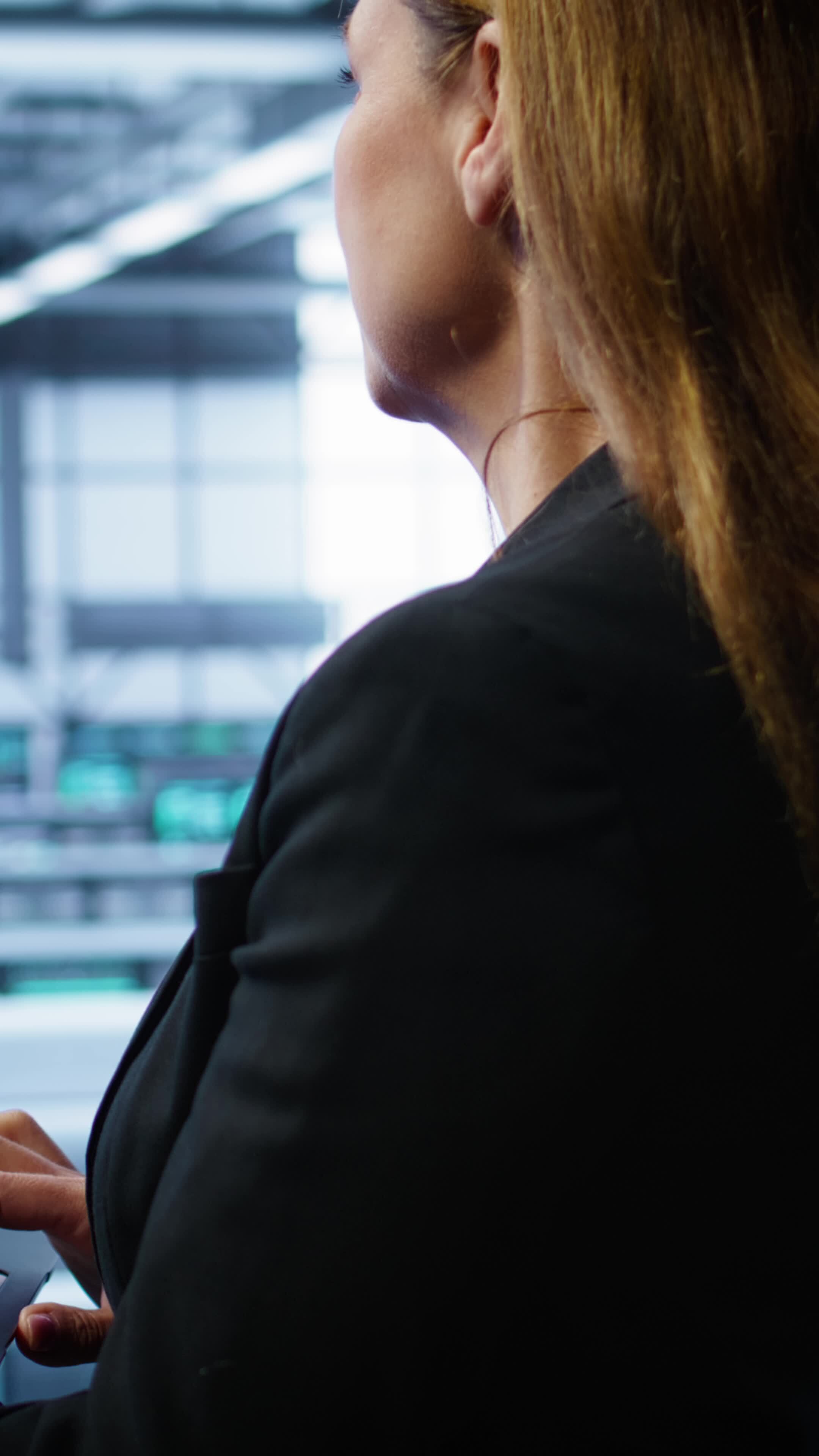 Vertical Technician doing checkup, inputting data on laptop of needed server hub fixes. Close up ...