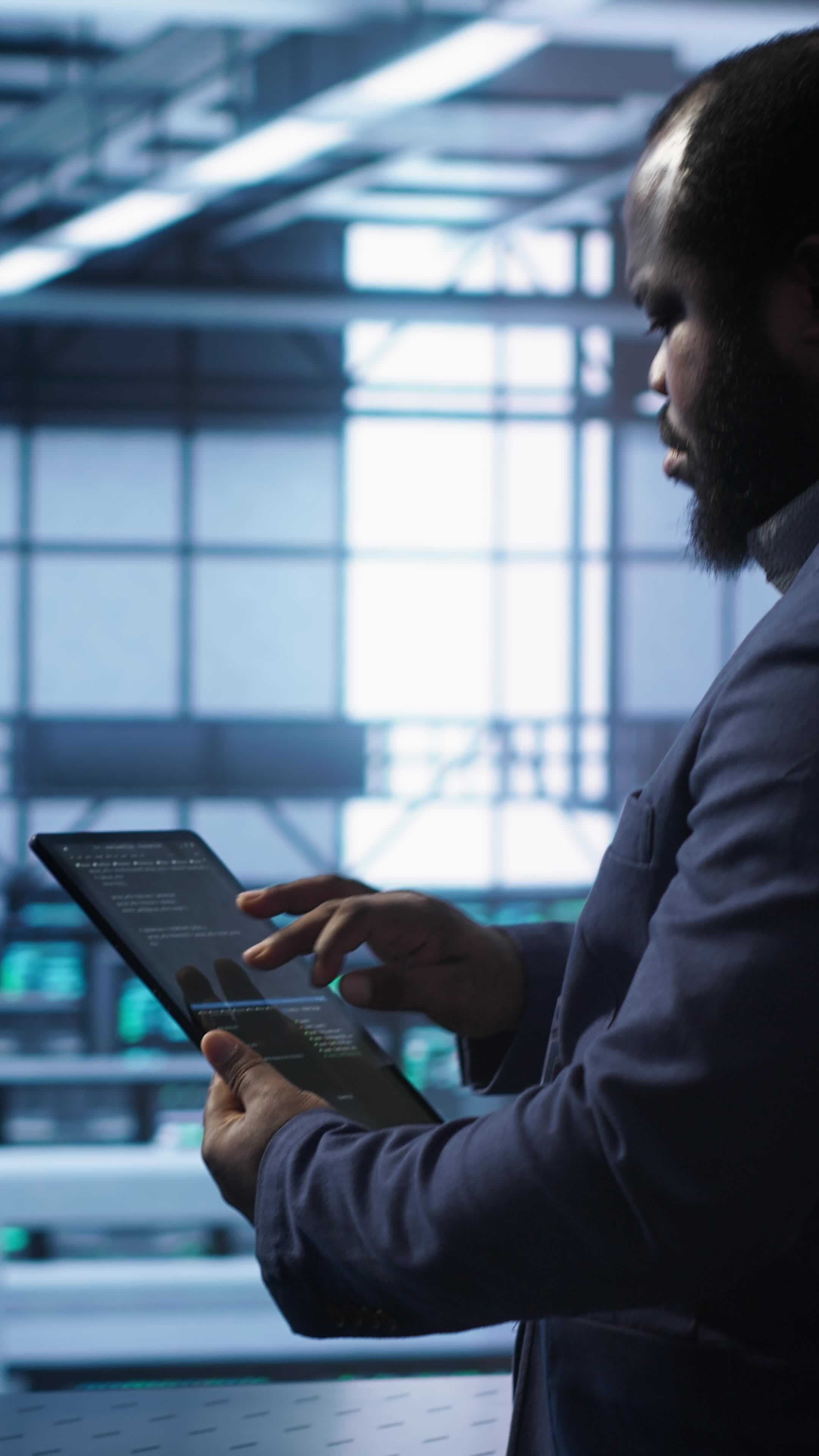Vertical System administrator in server room establishment installing newly ordered storage unit ...